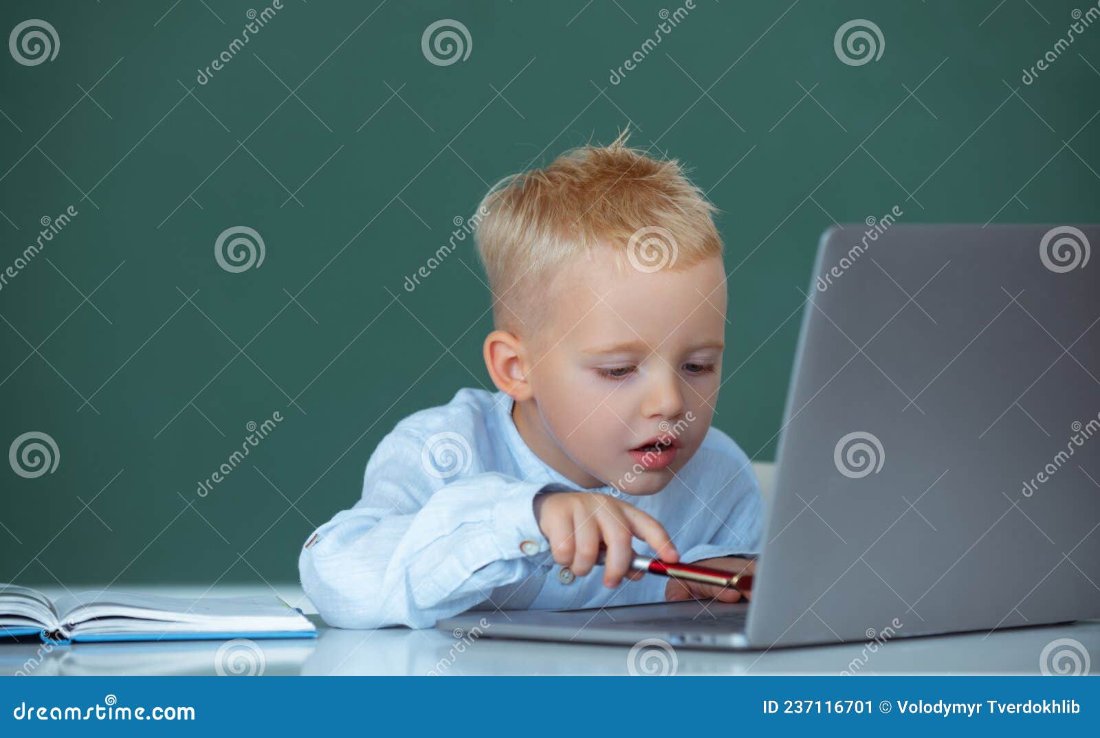 School Child Using Digital Pc Laptop in Class. Portrait of Funny Pupil ...