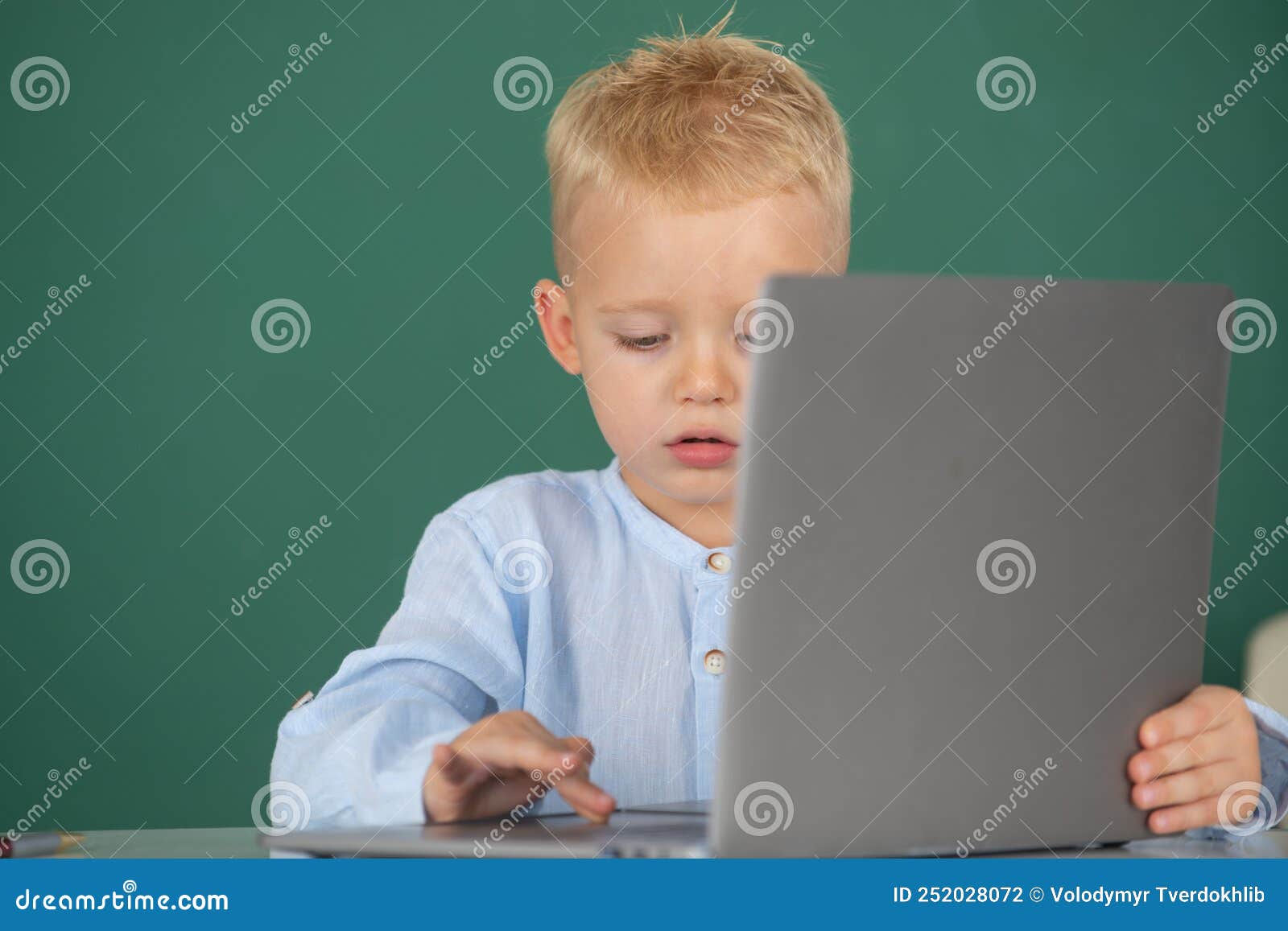 School Child Using Digital Pc Laptop in Class. Portrait of Funny Pupil ...