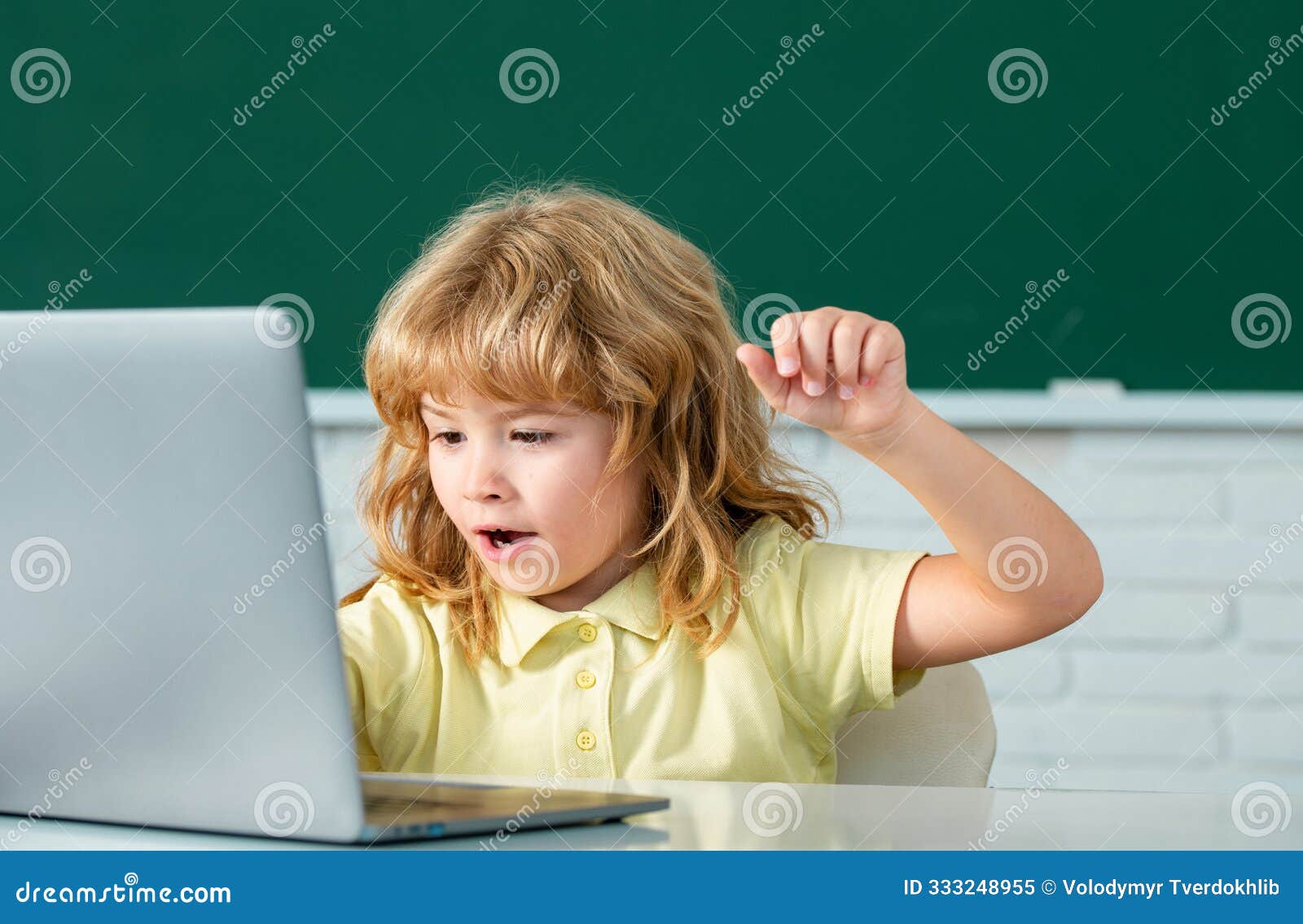 School Child Using Digital Pc Laptop in Class. Portrait of Funny Pupil ...