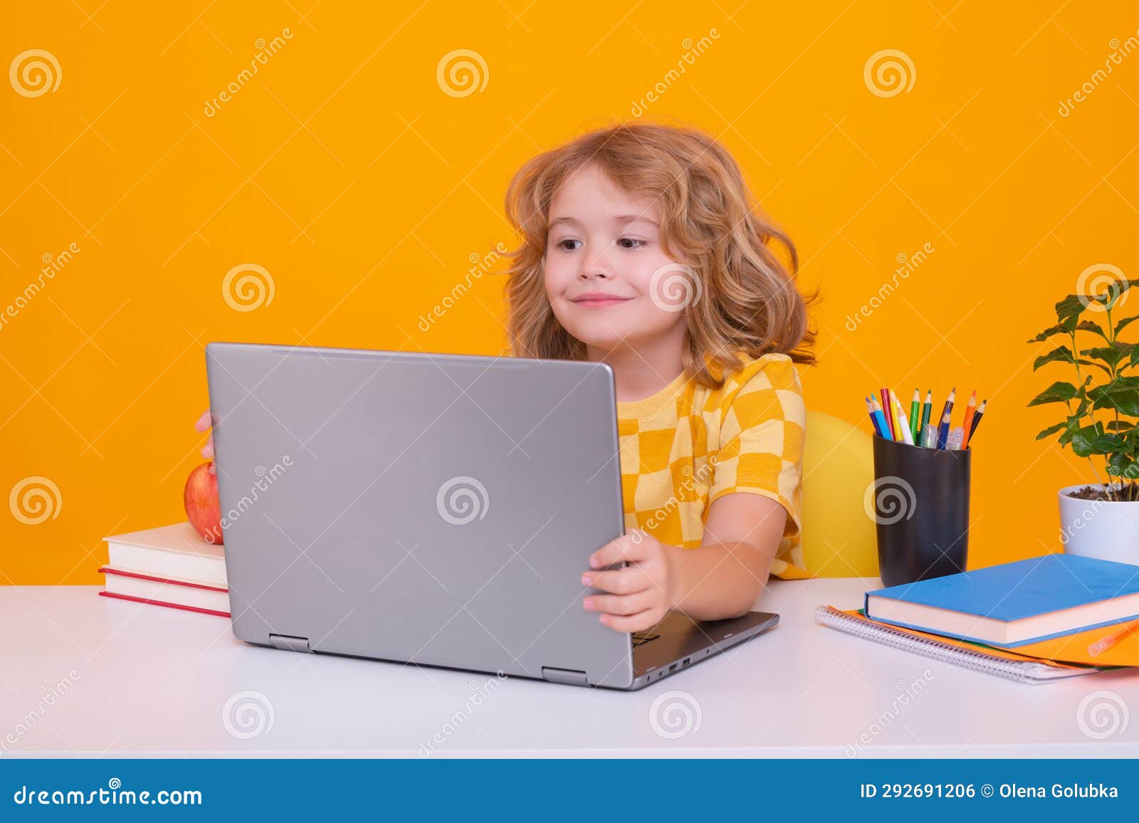 School Child Using Laptop Computer. School Child 7-8 Years Old with ...