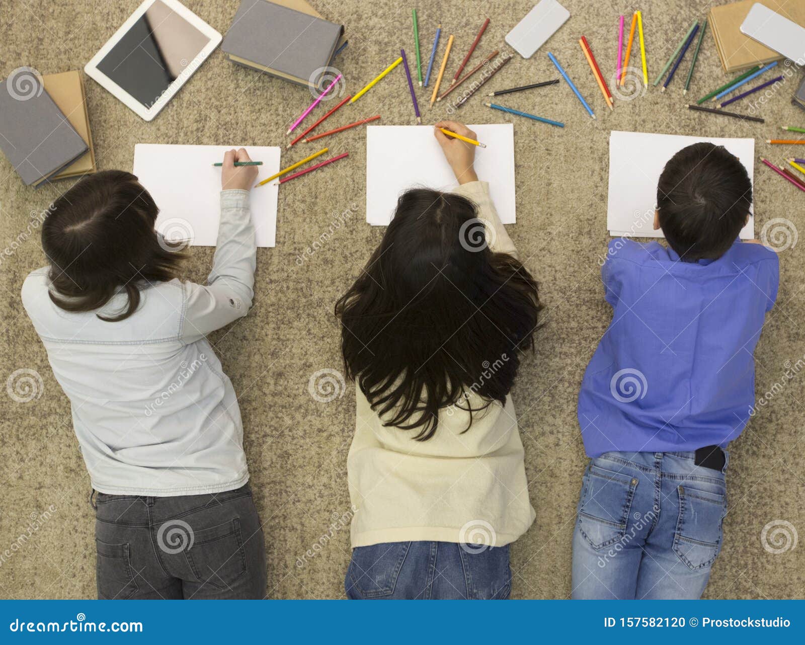 School Children Drawing with Colored Pencils on Carpet Stock Photo ...