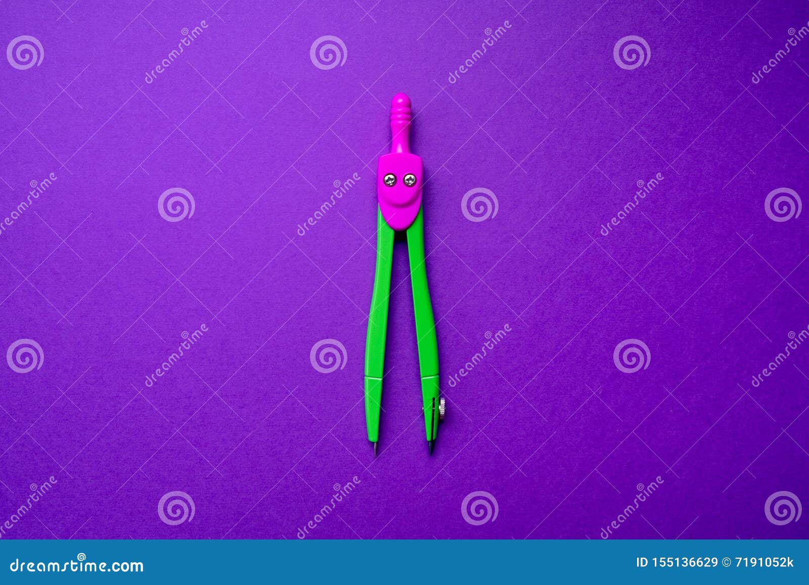 School Color Compasses for Drawing Circles..on Purple Paper Background ...