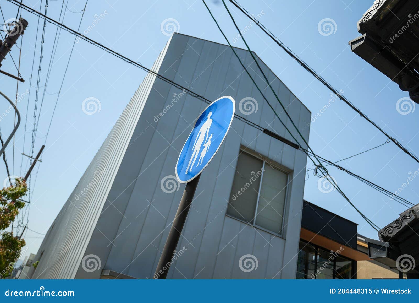 School Crossing Sign in Front of a Modern Building Stock Image - Image ...