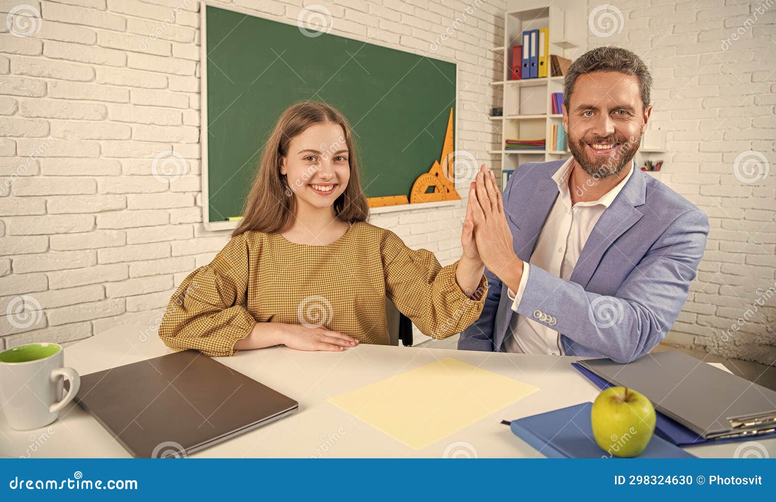 School Education. Happy Child Study in Classroom with Tutor. Give Five ...