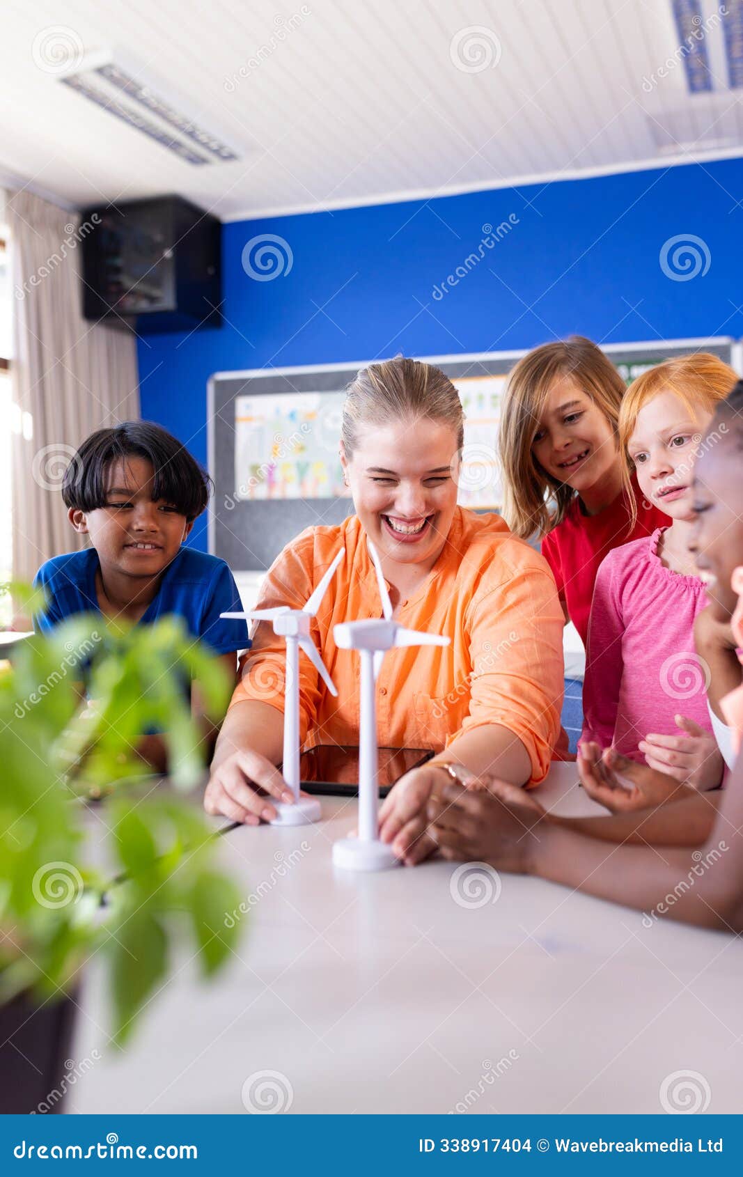 In School, Female Teacher and Diverse Students Experimenting with Wind ...