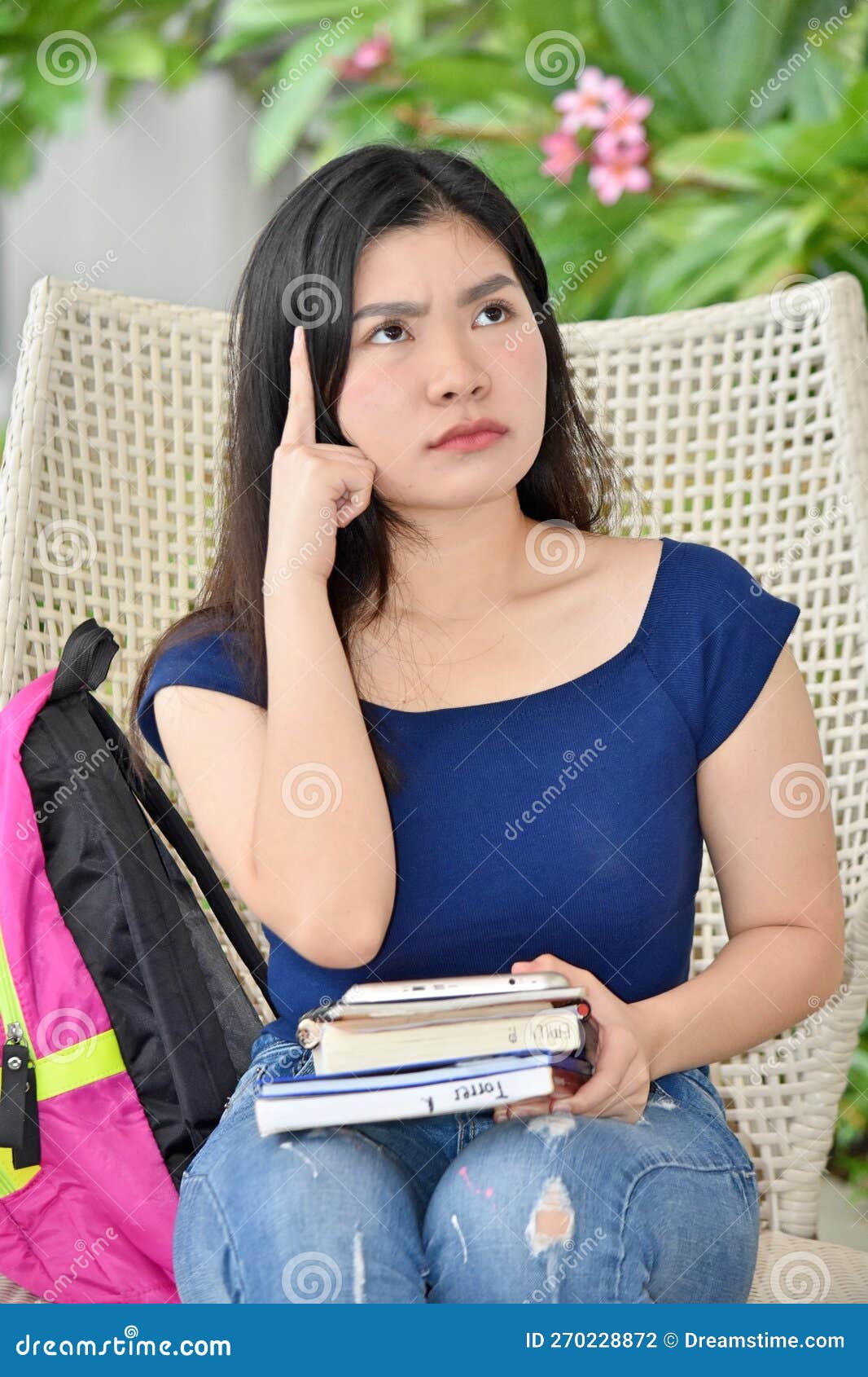 A School Girl Deciding with Notebooks Stock Photo - Image of person ...