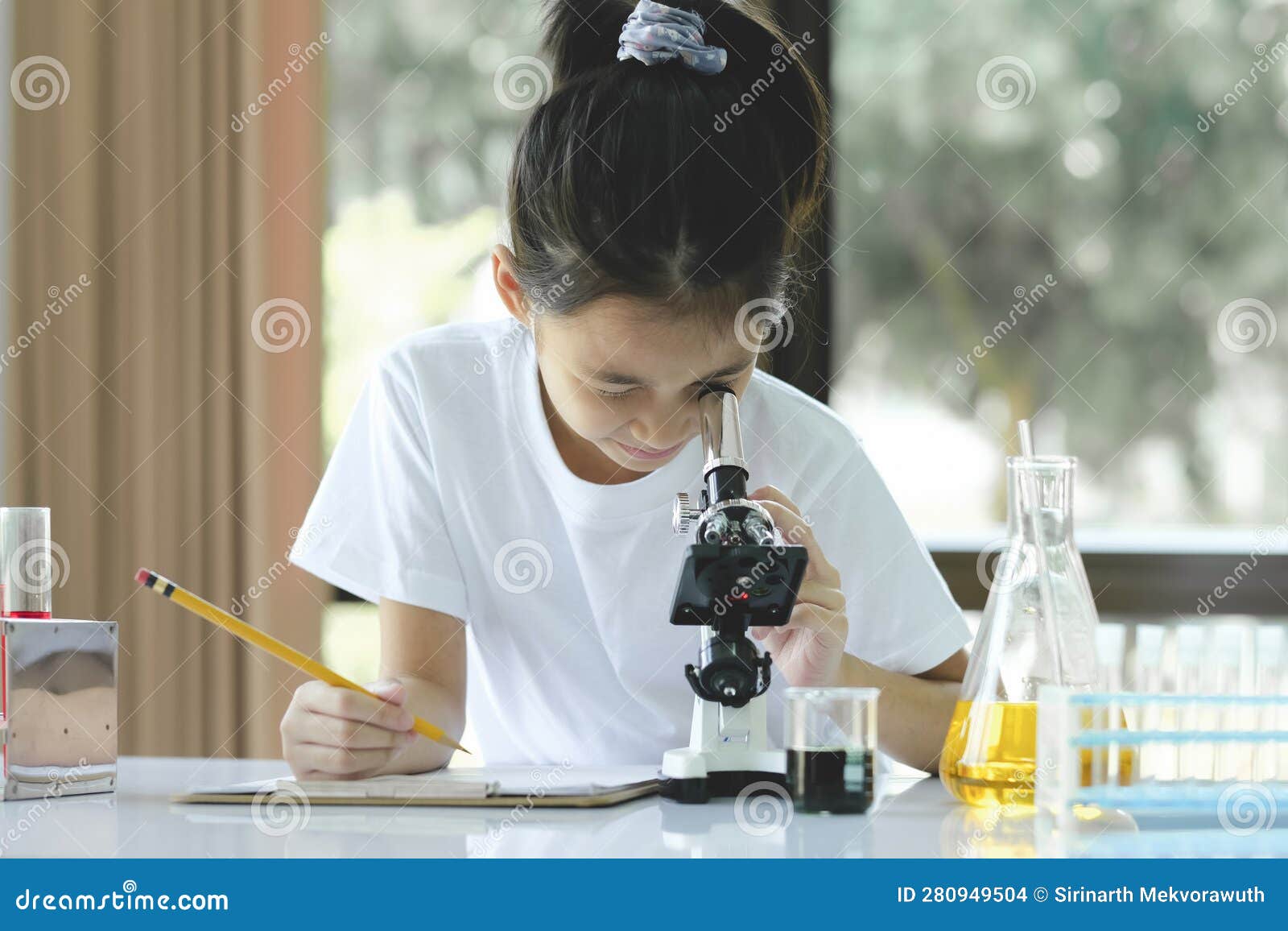 Little Child with Learning Class in School Laboratory Using Microscope ...