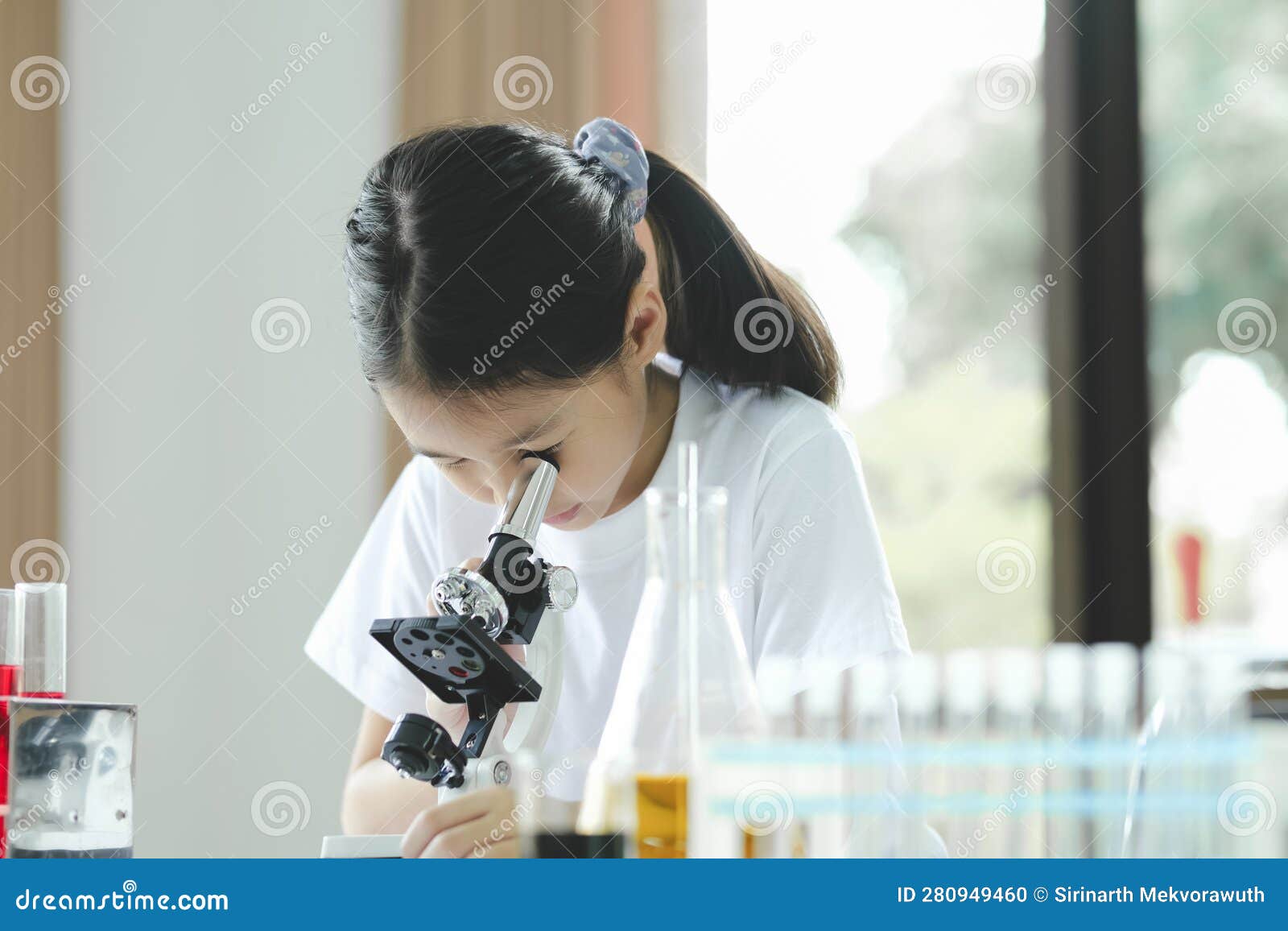Little Child with Learning Class in School Laboratory Using Microscope ...
