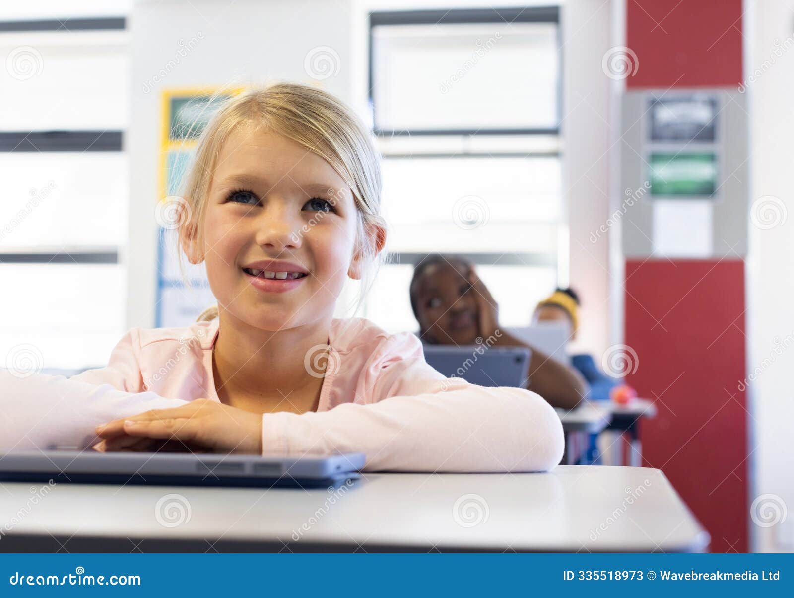 In School, Girl Smiling and Using Laptop in Classroom, Focusing on ...