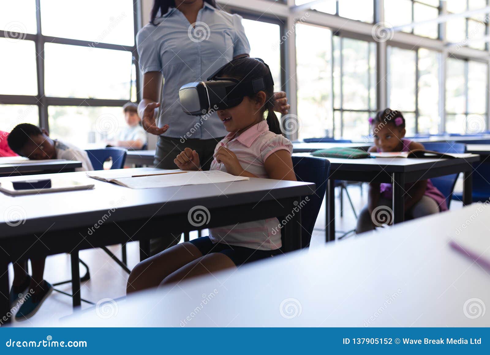 School Girl Using Virtual Reality Headset at Desk in Classroom Stock ...