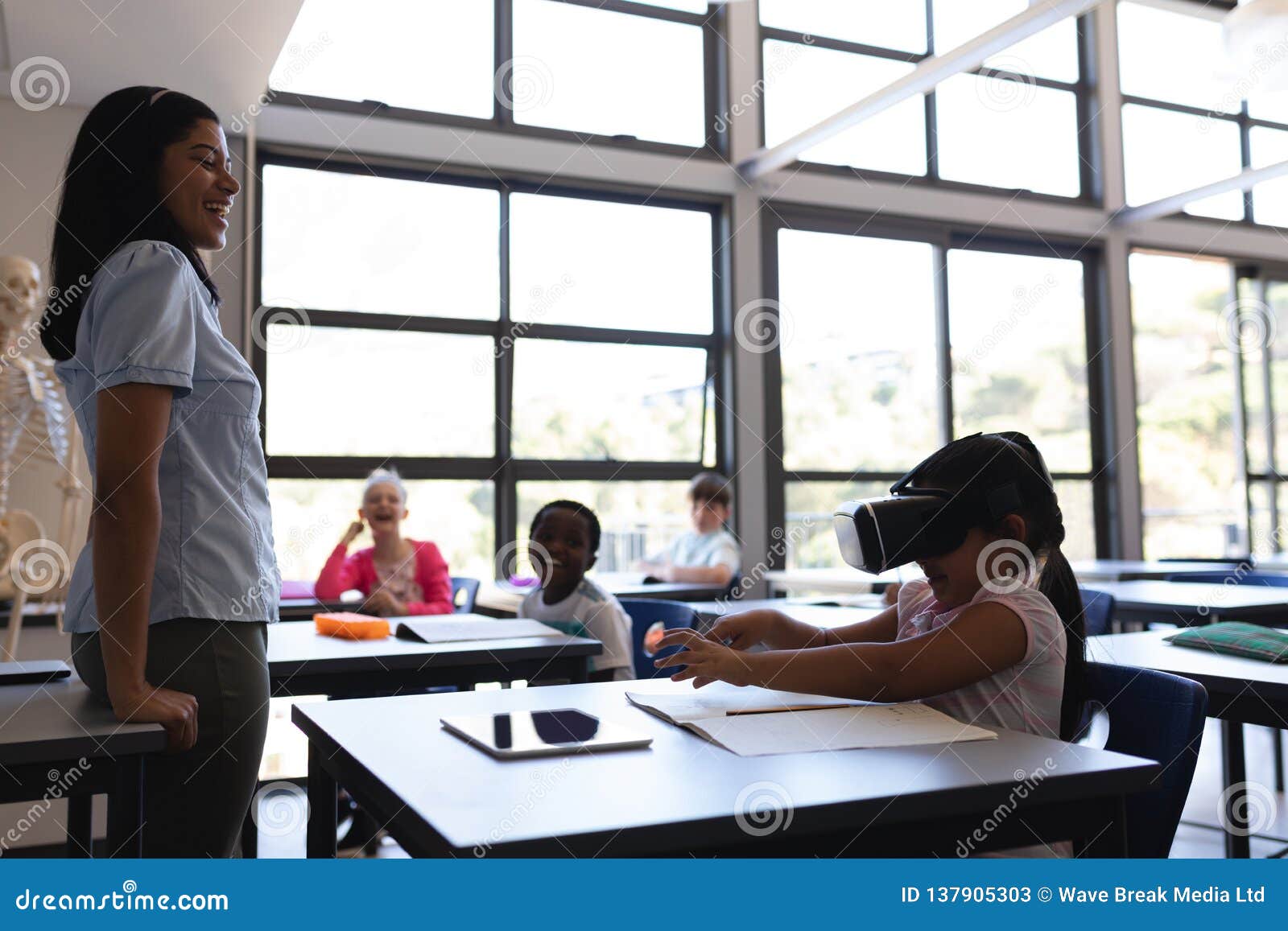 School Girl Using Virtual Reality Headset at Desk in Classroom Stock ...