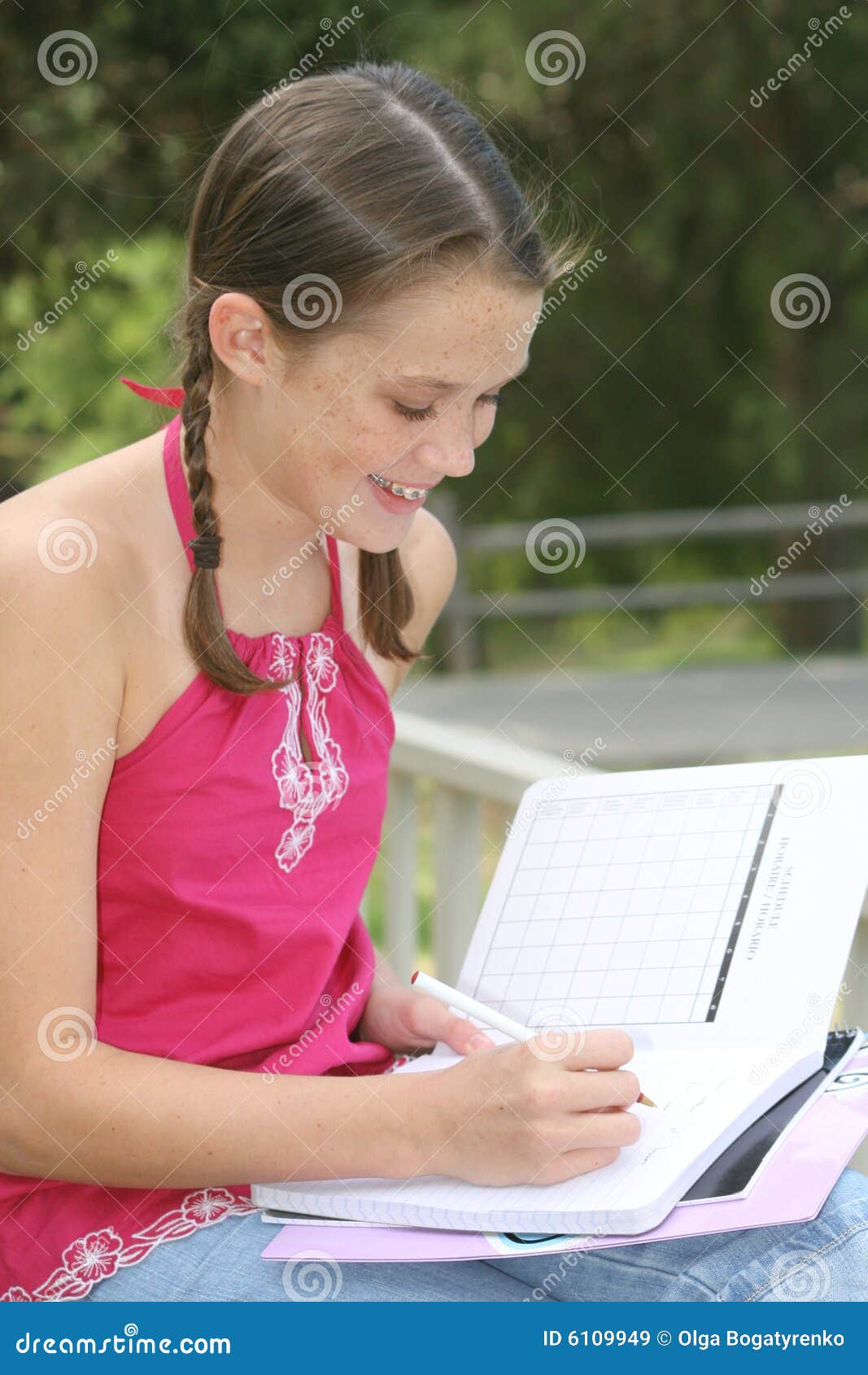 School GIrl Writing in Notebook Outdoors Stock Image - Image of ...