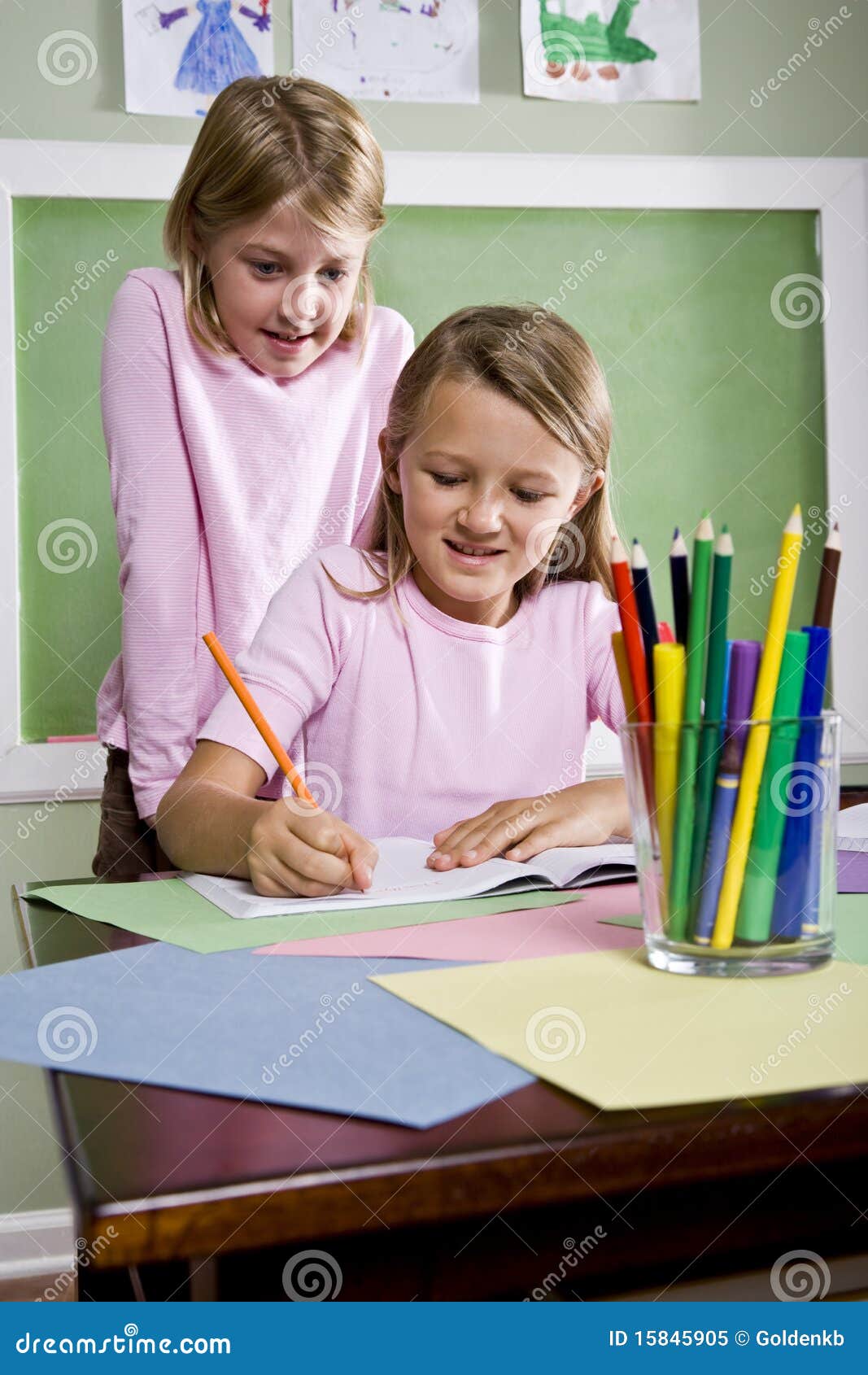 School Girls Writing in Notebook in Classroom Stock Image - Image of ...
