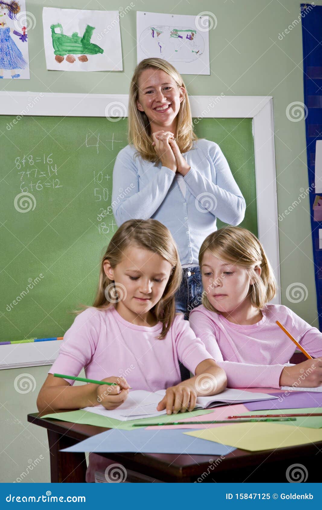 School Girls Writing in Notebooks with Teacher Stock Image - Image of ...