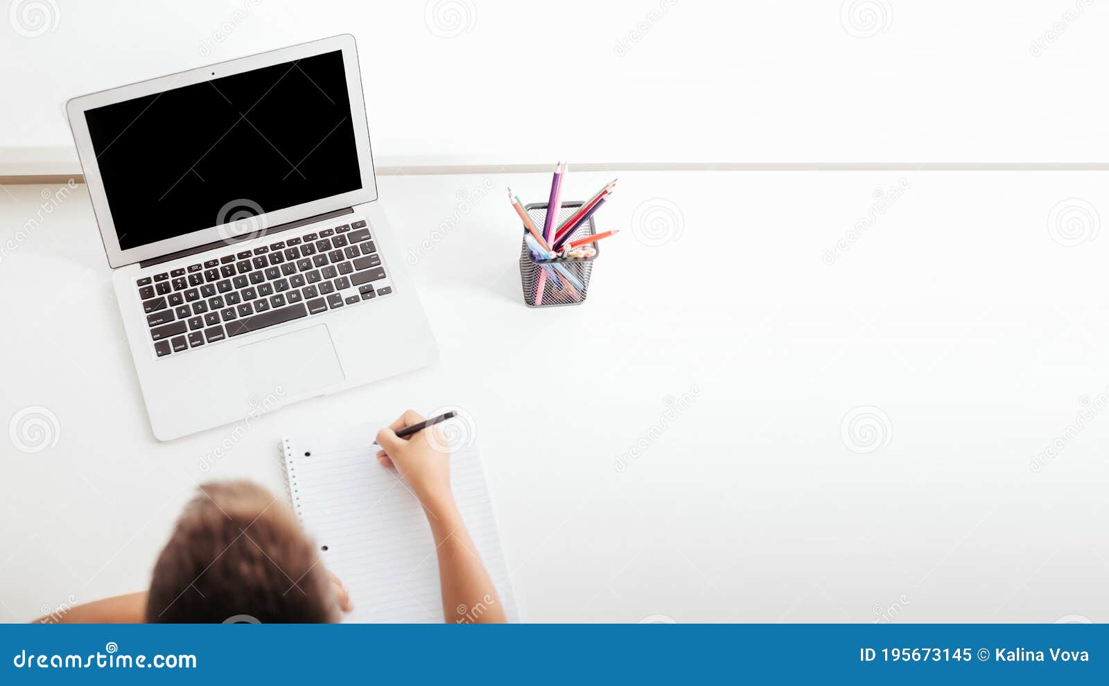 A School at Home through Online Homeschooling. the Child is Sitting at ...