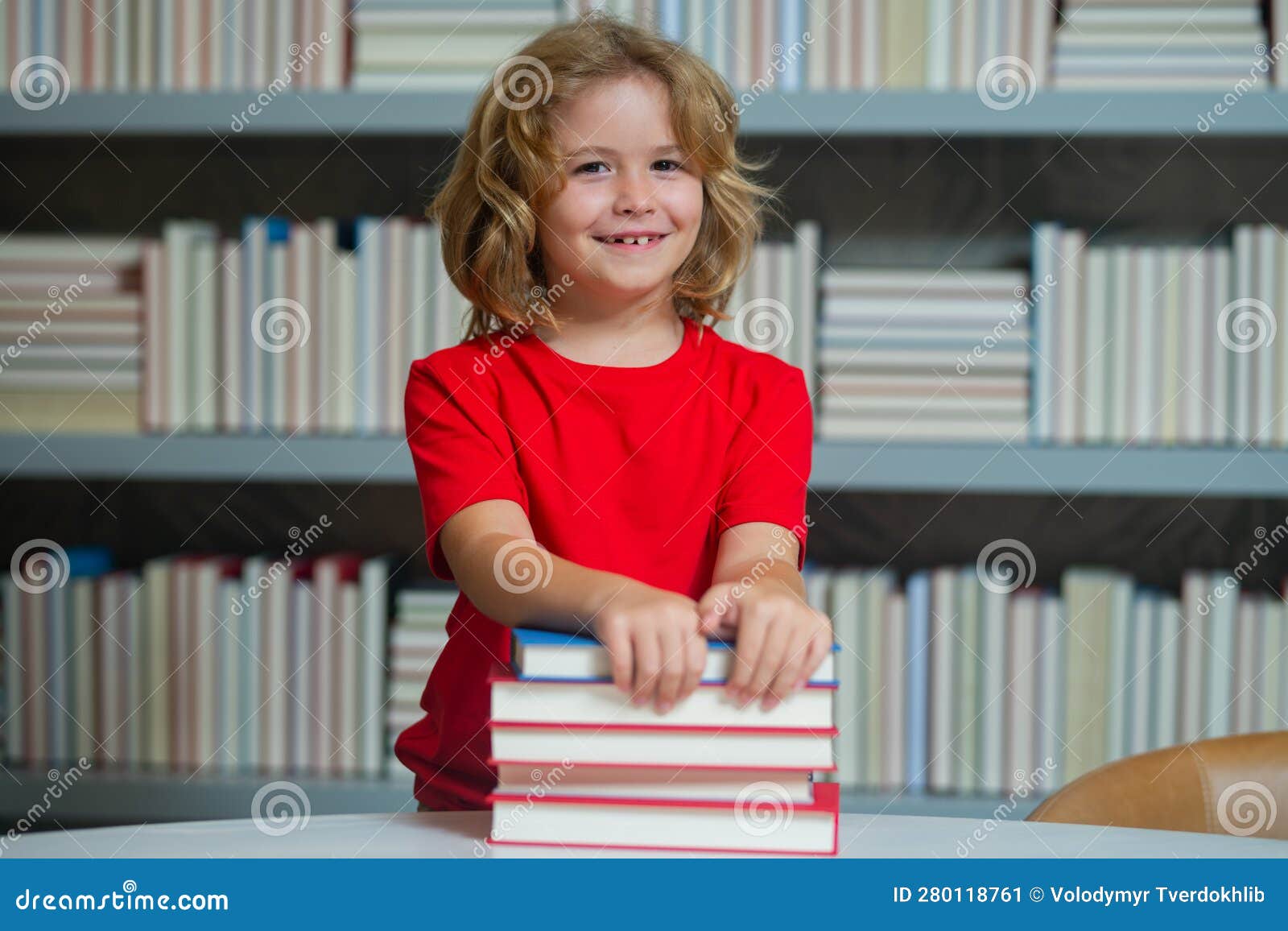 School Kid Pupil Studying in School Library. Child Reading Book in ...