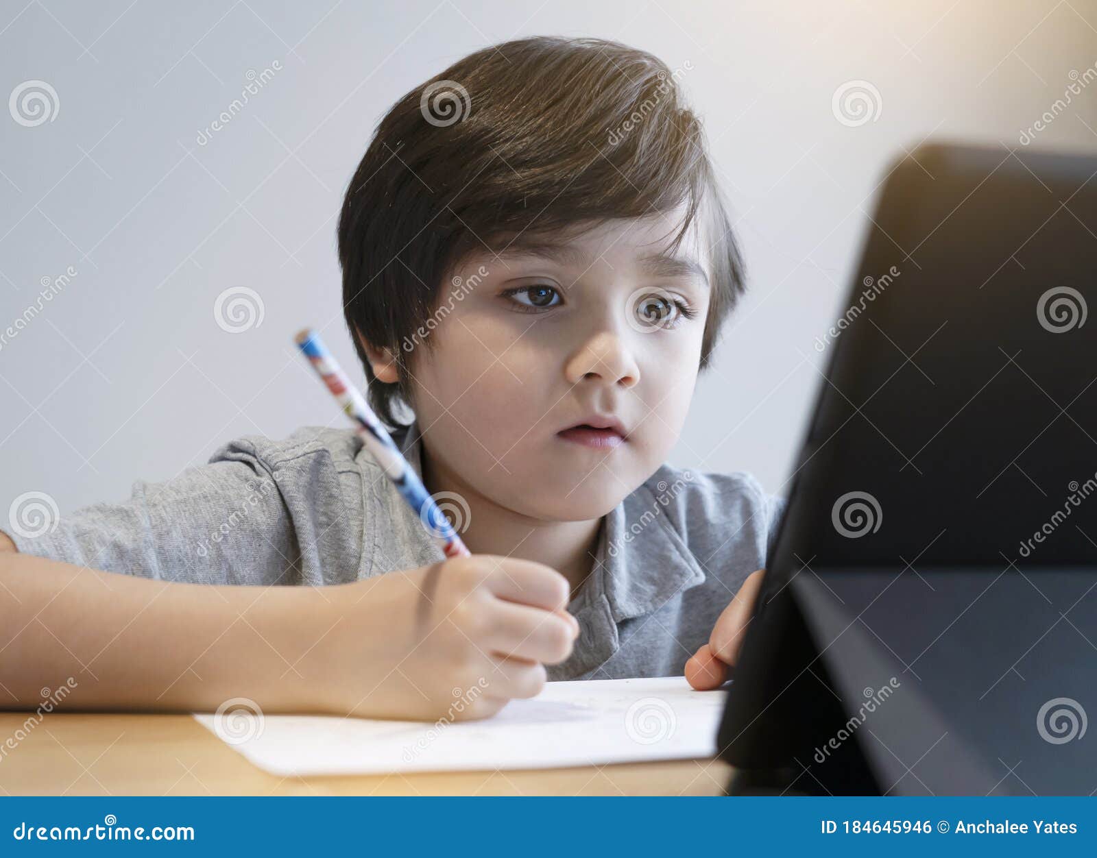 School Kid Self Isolation Using Tablet for His Homework, Child Doing ...