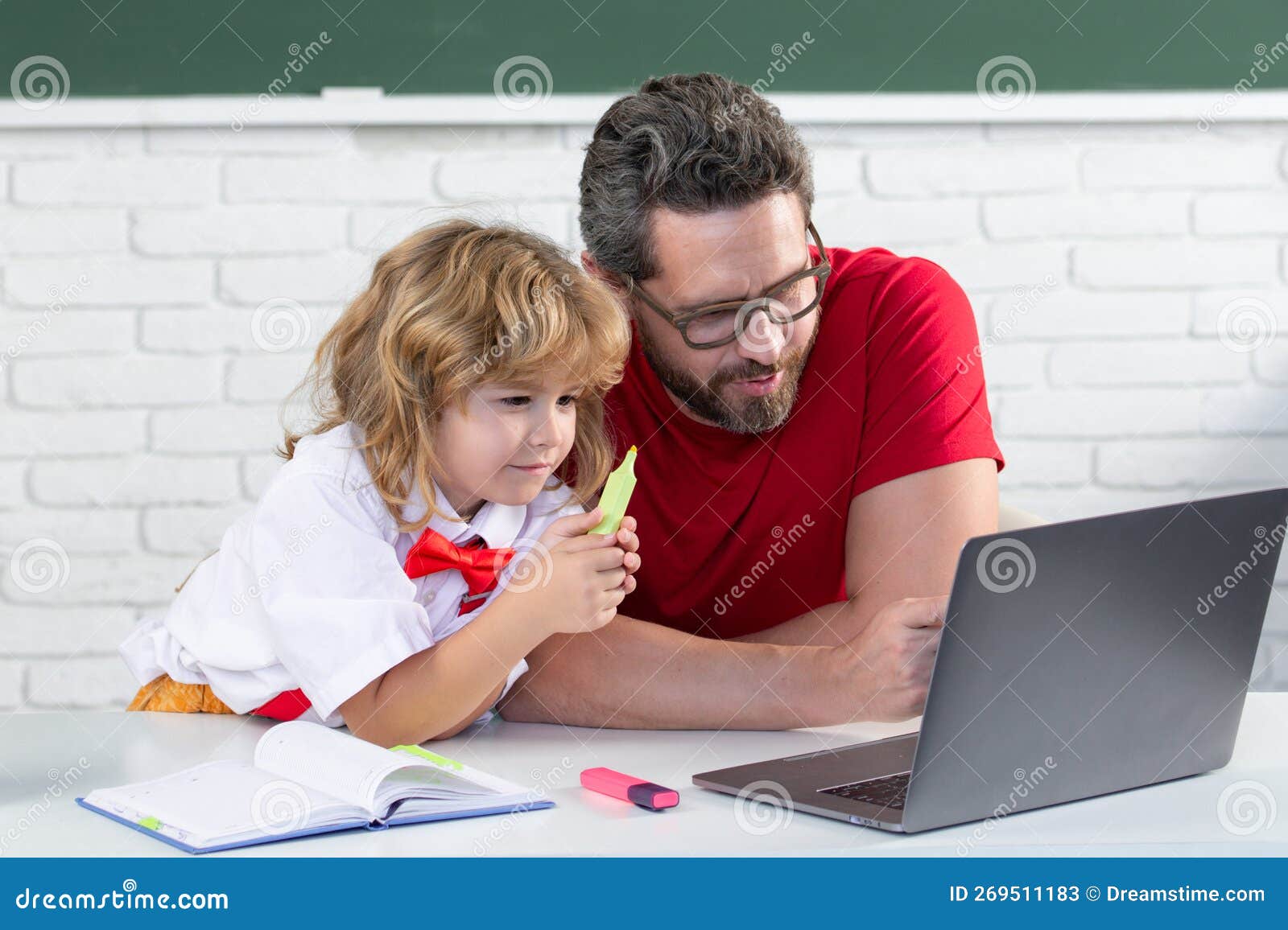 School Kid and Teacher Learning Study in Class. Elementary School Boy ...