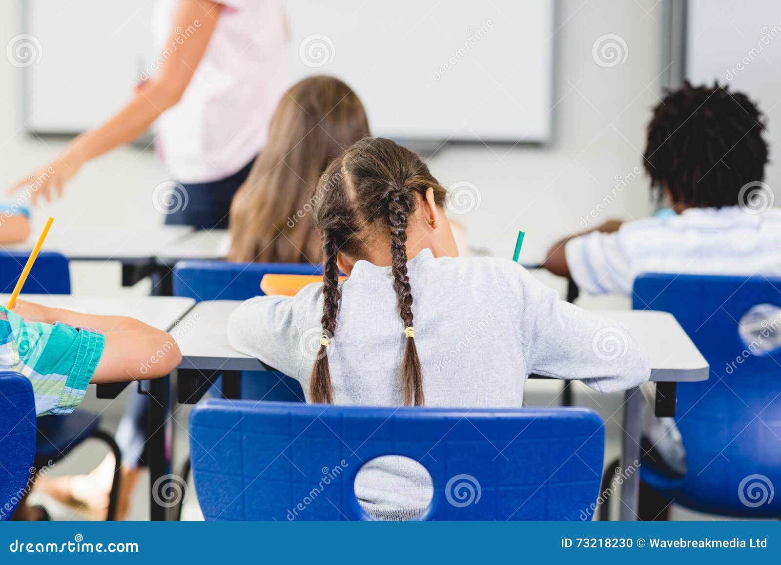 School Kids Doing Homework in Classroom Stock Photo - Image of class ...