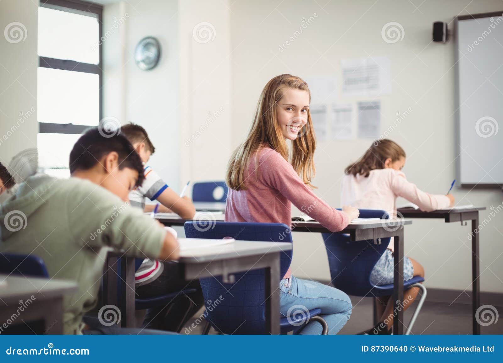 School Kids Doing Homework in Classroom Stock Photo - Image of cheerful ...