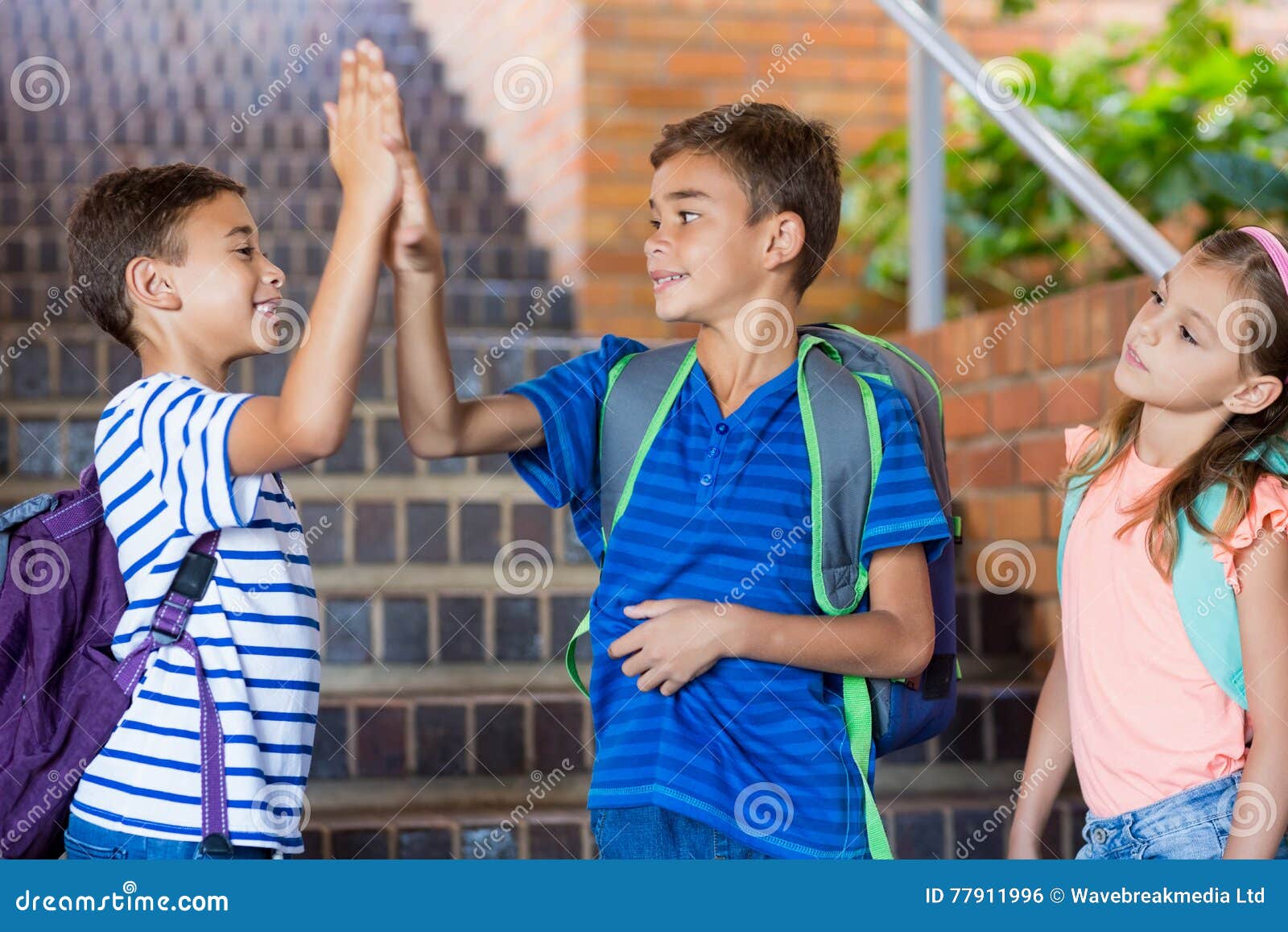 School Kids Giving High Five on Staircase Stock Photo - Image of ...