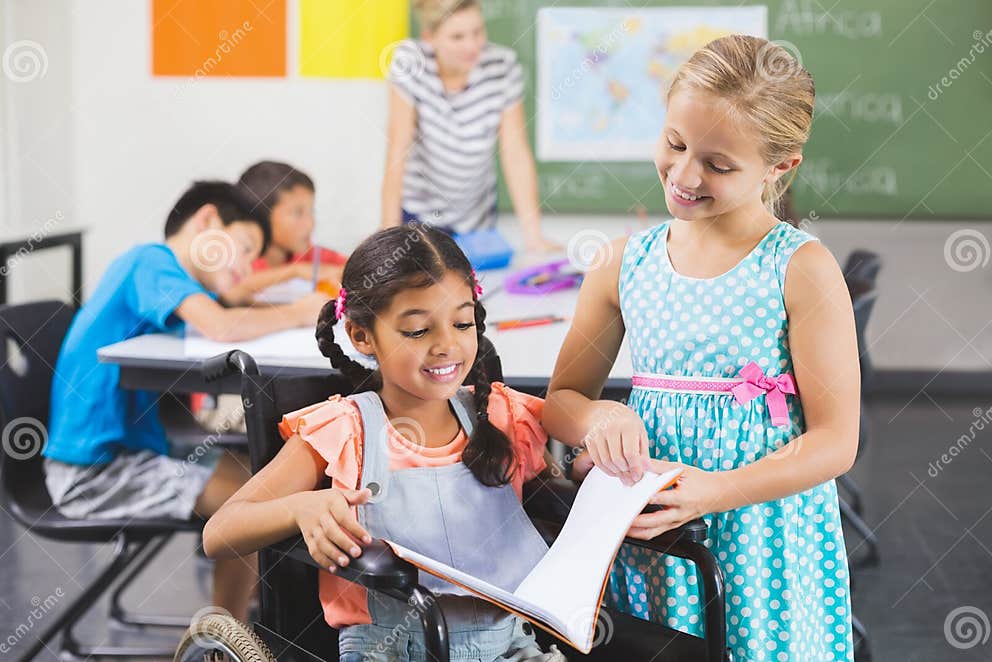 School Kids Reading Book in Classroom Stock Photo - Image of chair ...