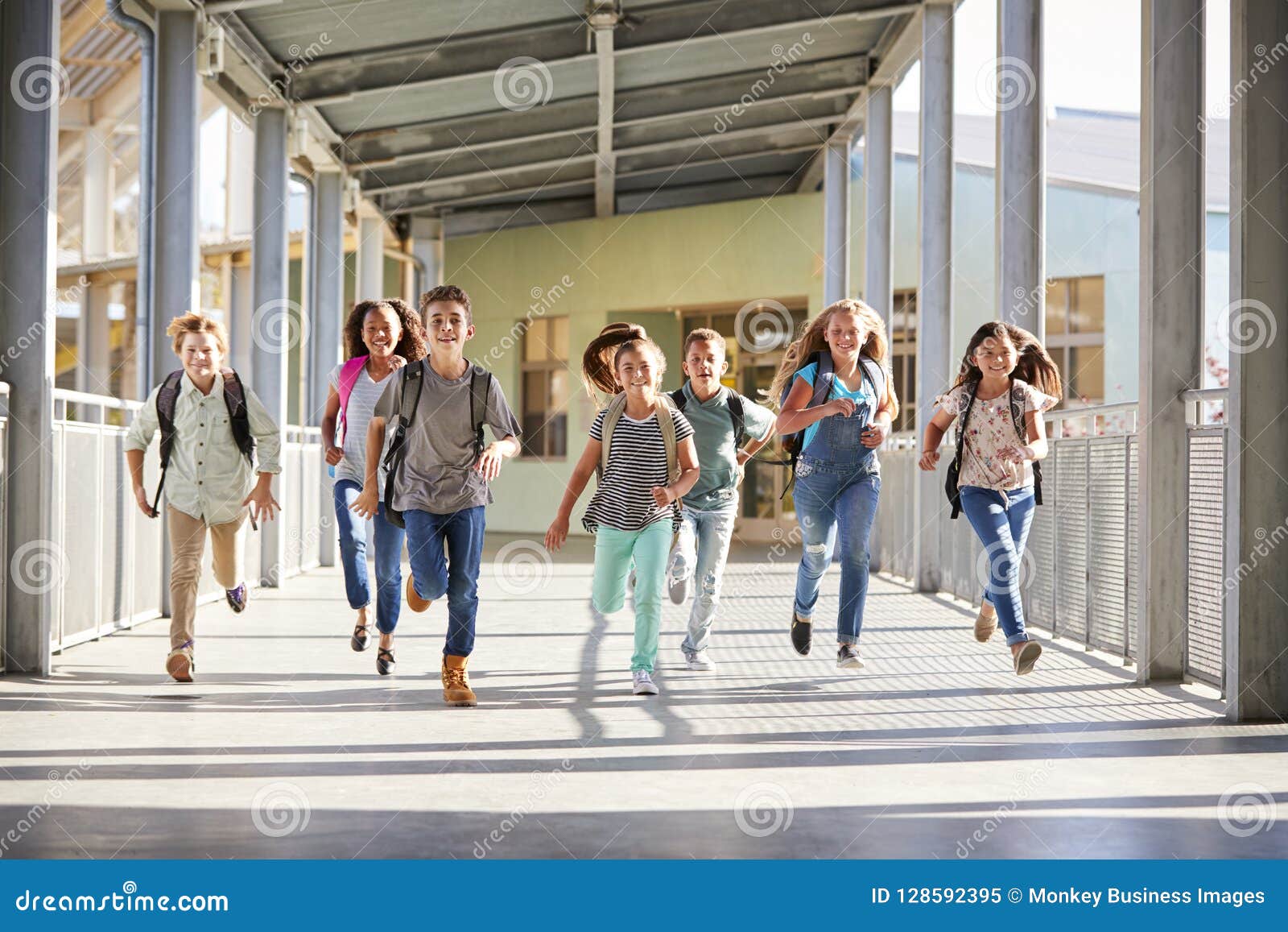 School Kids Running in Elementary School Corridor, Close Up Stock Image ...