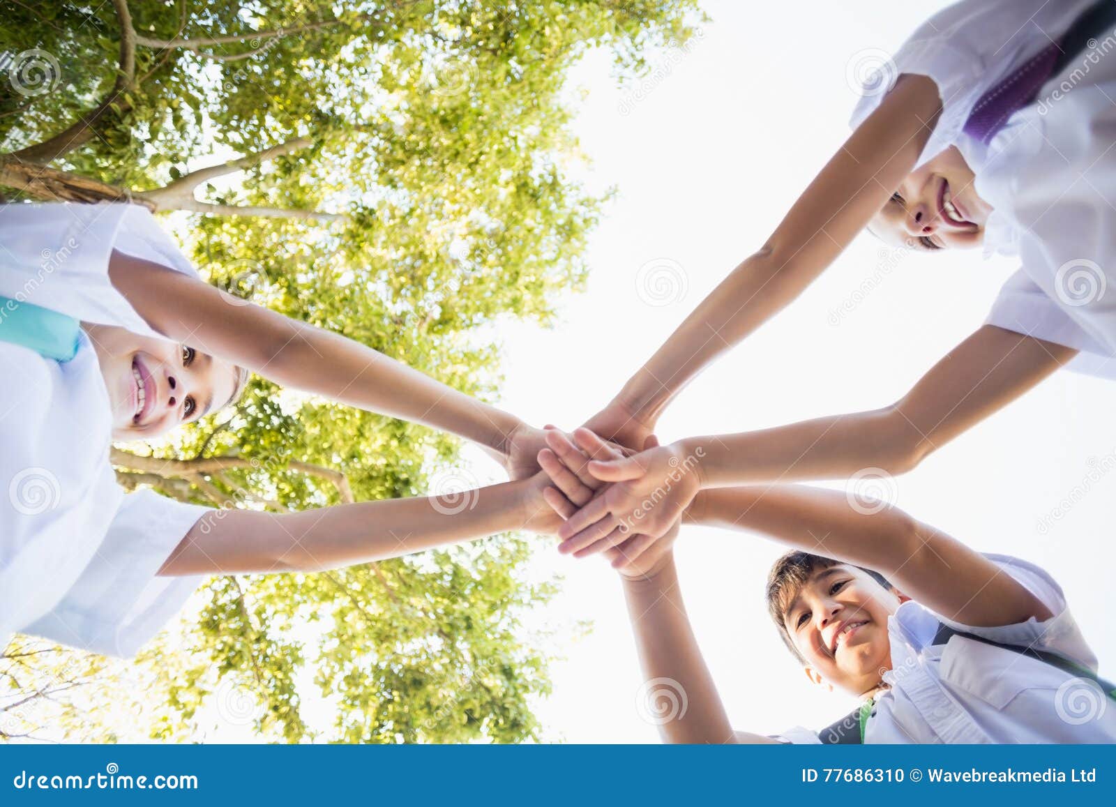 School Kids Stacking Hands in Campus Stock Photo - Image of education ...