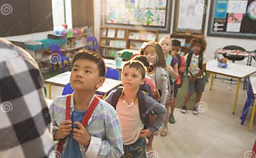 School Kids Standing and Forming a Queue in Classroom at School Stock ...