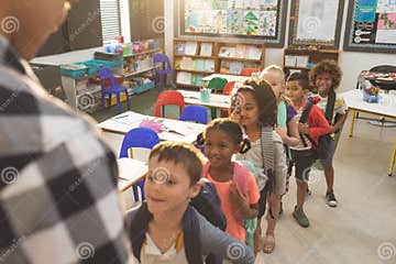 School Kids Standing and Forming a Queue in Classroom at School Stock ...
