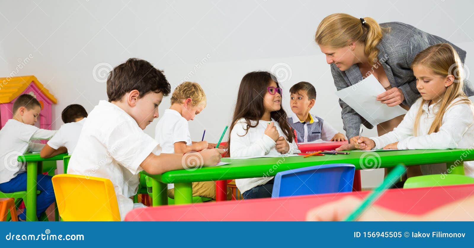 School Kids Studying in Classroom with Teacher Stock Image - Image of ...