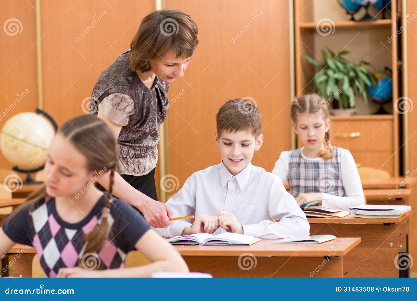 School Kids and Teacher at Lesson Stock Photo - Image of classroom ...
