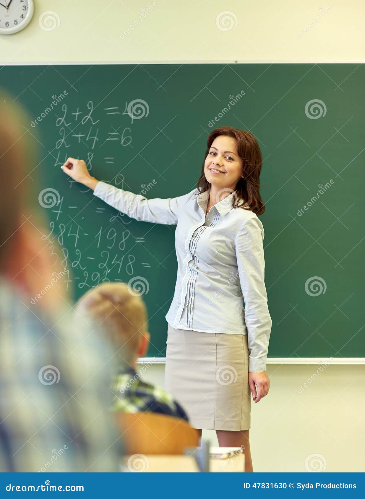 School Kids And Teacher Writing On Chalkboard Stock Photography ...