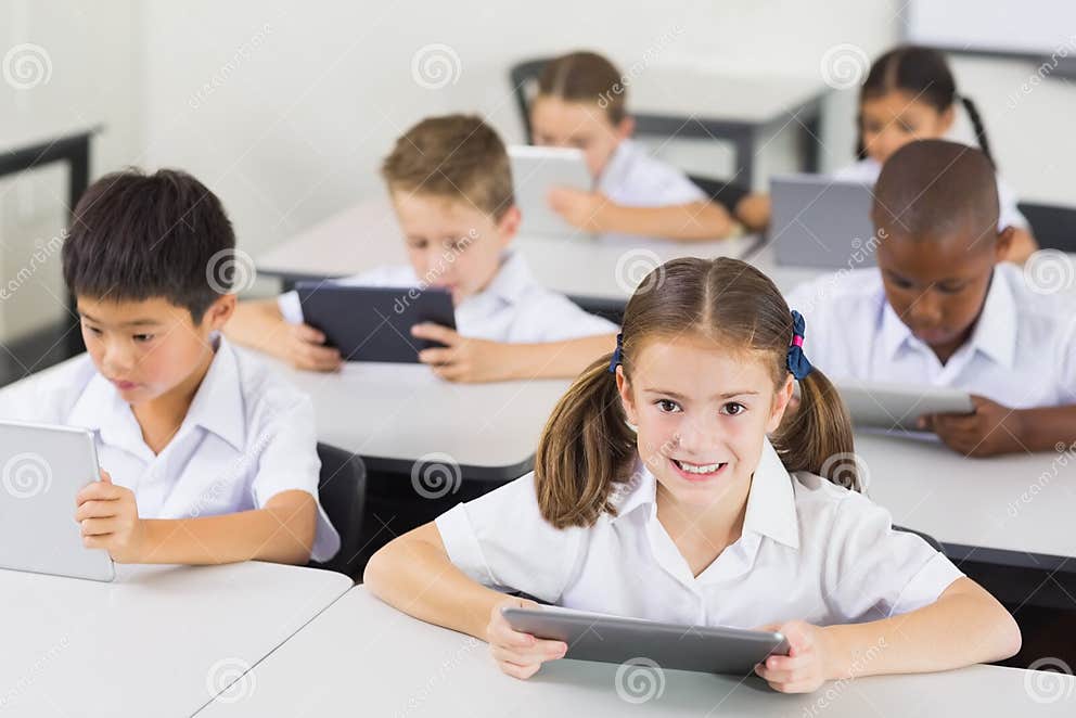 School Kids Using Digital Tablet in Classroom Stock Image - Image of ...