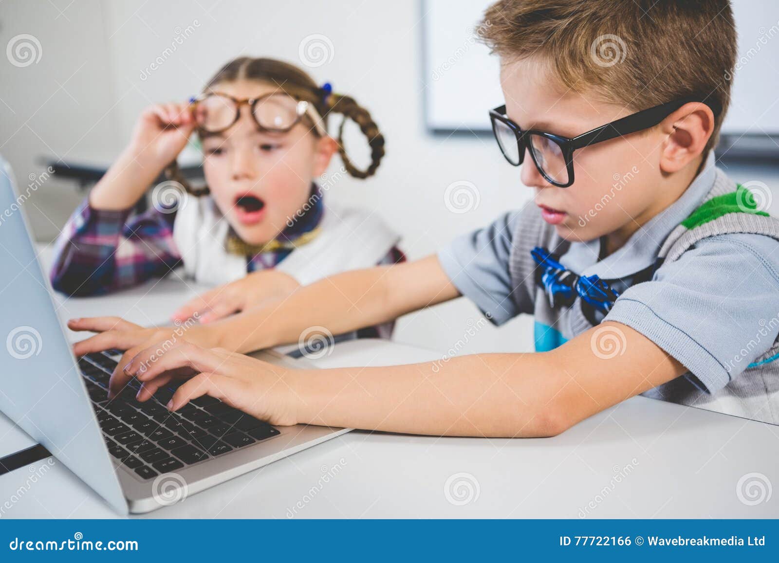 School Kids Using a Laptop in Classroom Stock Photo - Image of ...