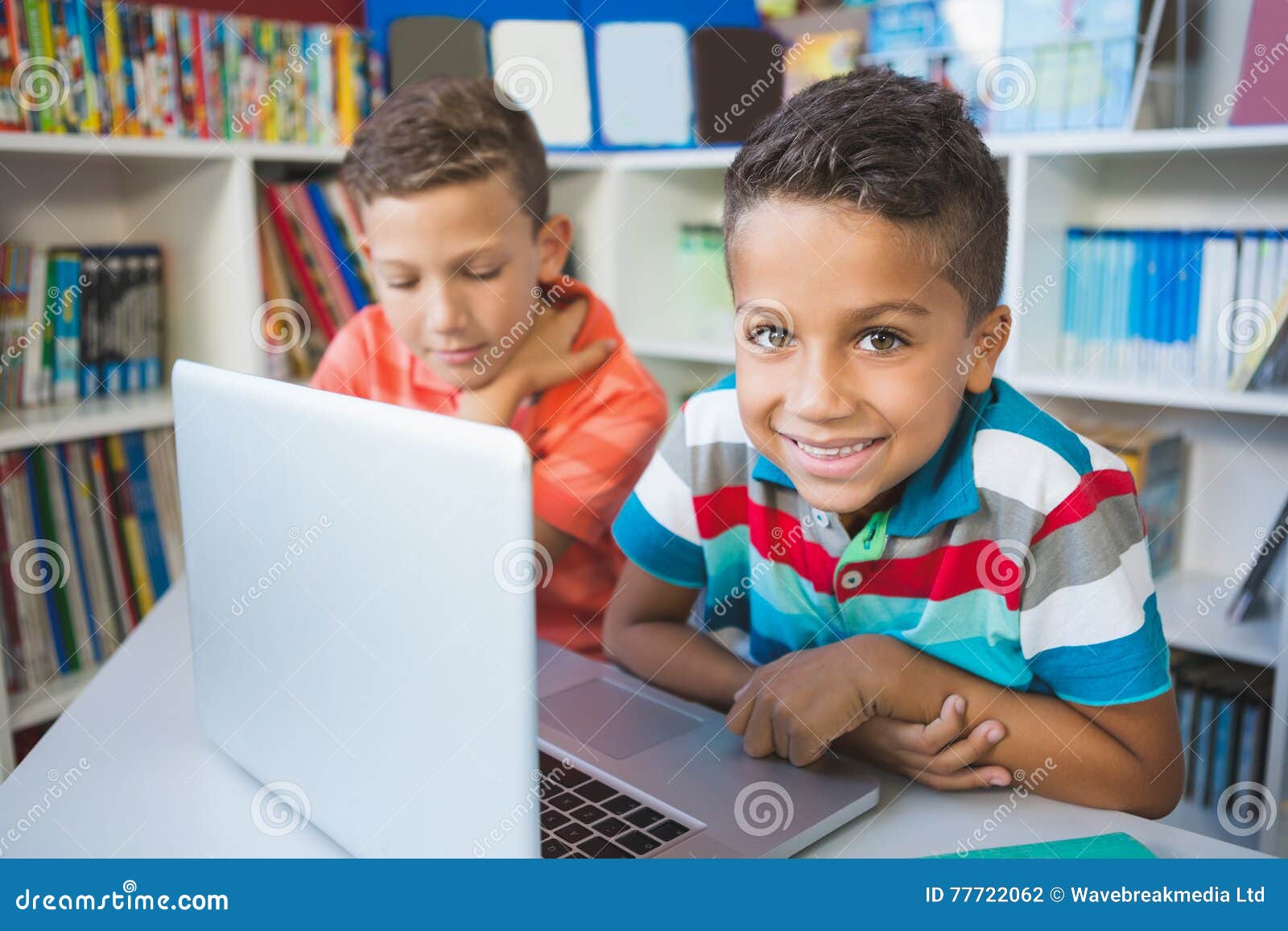 School Kids Using a Laptop in Library Stock Photo - Image of child ...