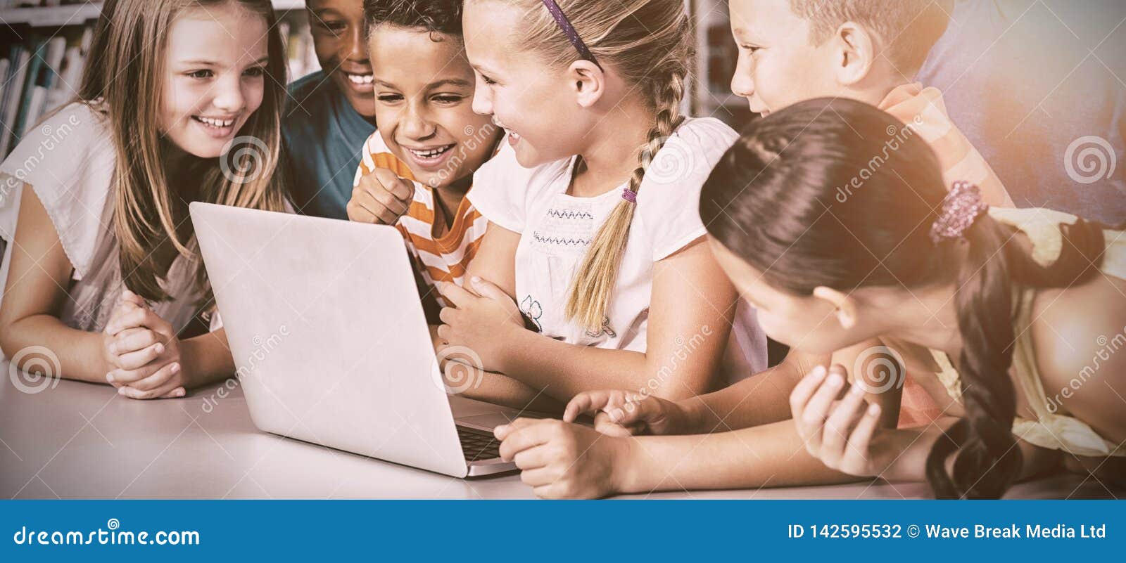School Kids Using Laptop in Library Stock Photo - Image of innocence ...