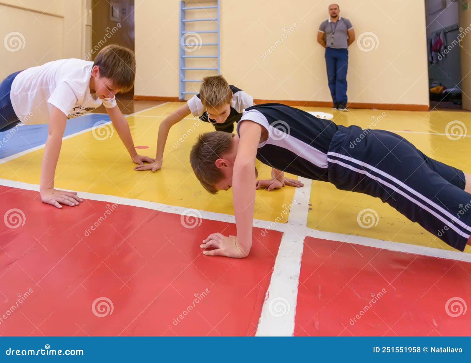 Schoolboys from Elementary School. Push-ups from the Floor in the Gym ...