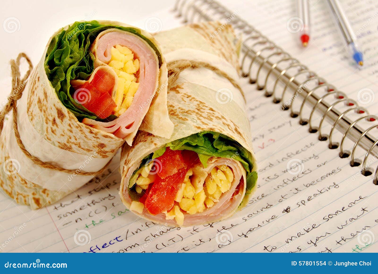 School Lunch: Ham and Cheese Wrap Sandwich on Notebook Stock Photo ...
