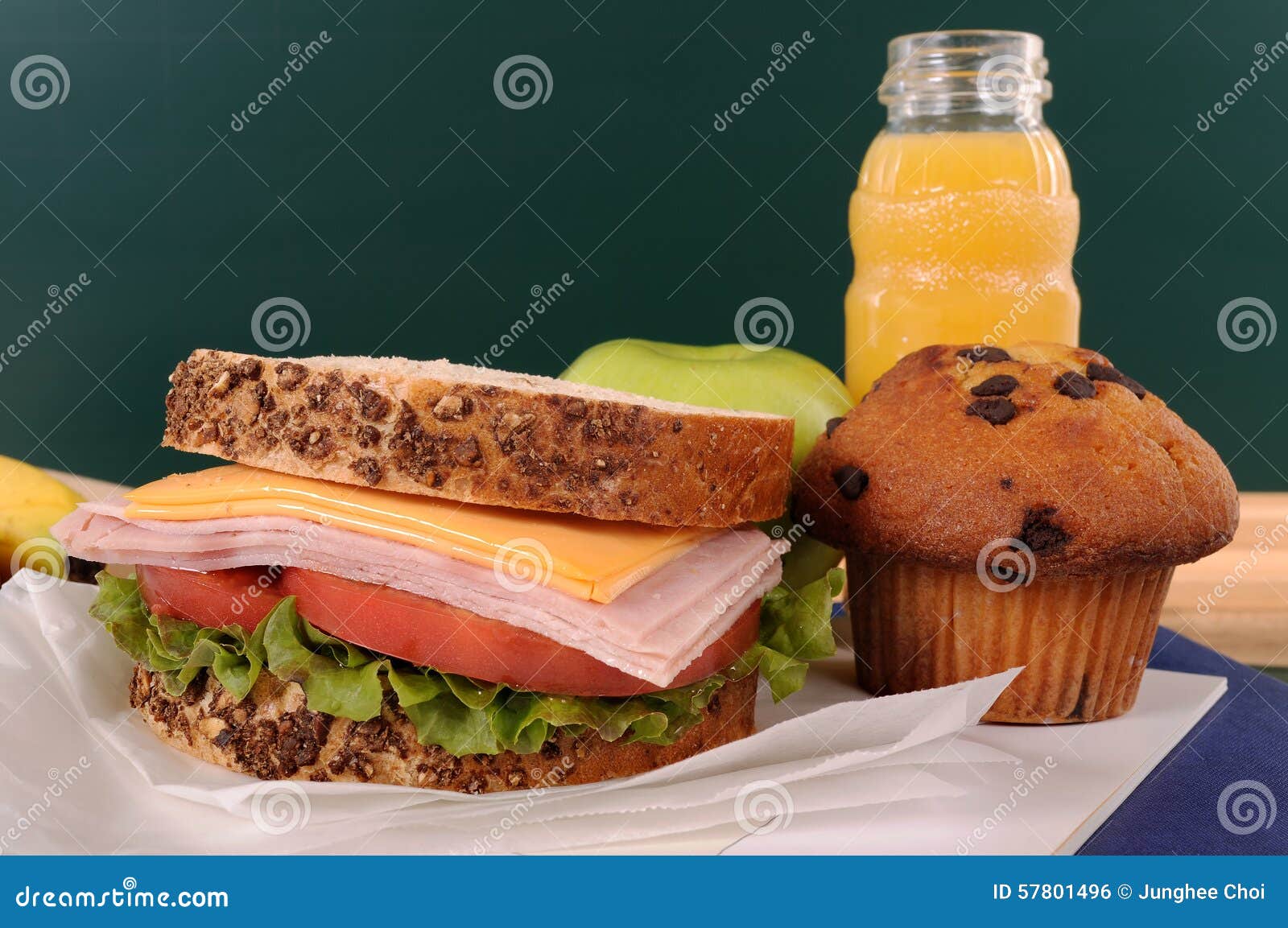 School Lunch Sandwich, Cake and Drink on Classroom Desk with Blackboard ...