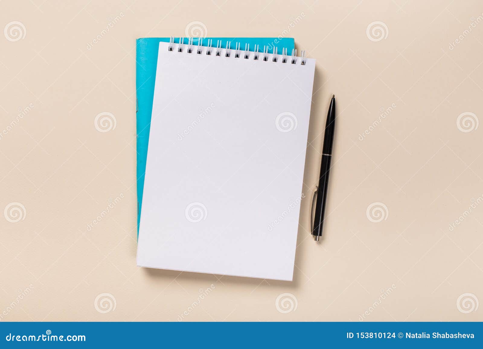 School Notepad and Pen on the Beige Desk. Spiral Notepad on a Table ...