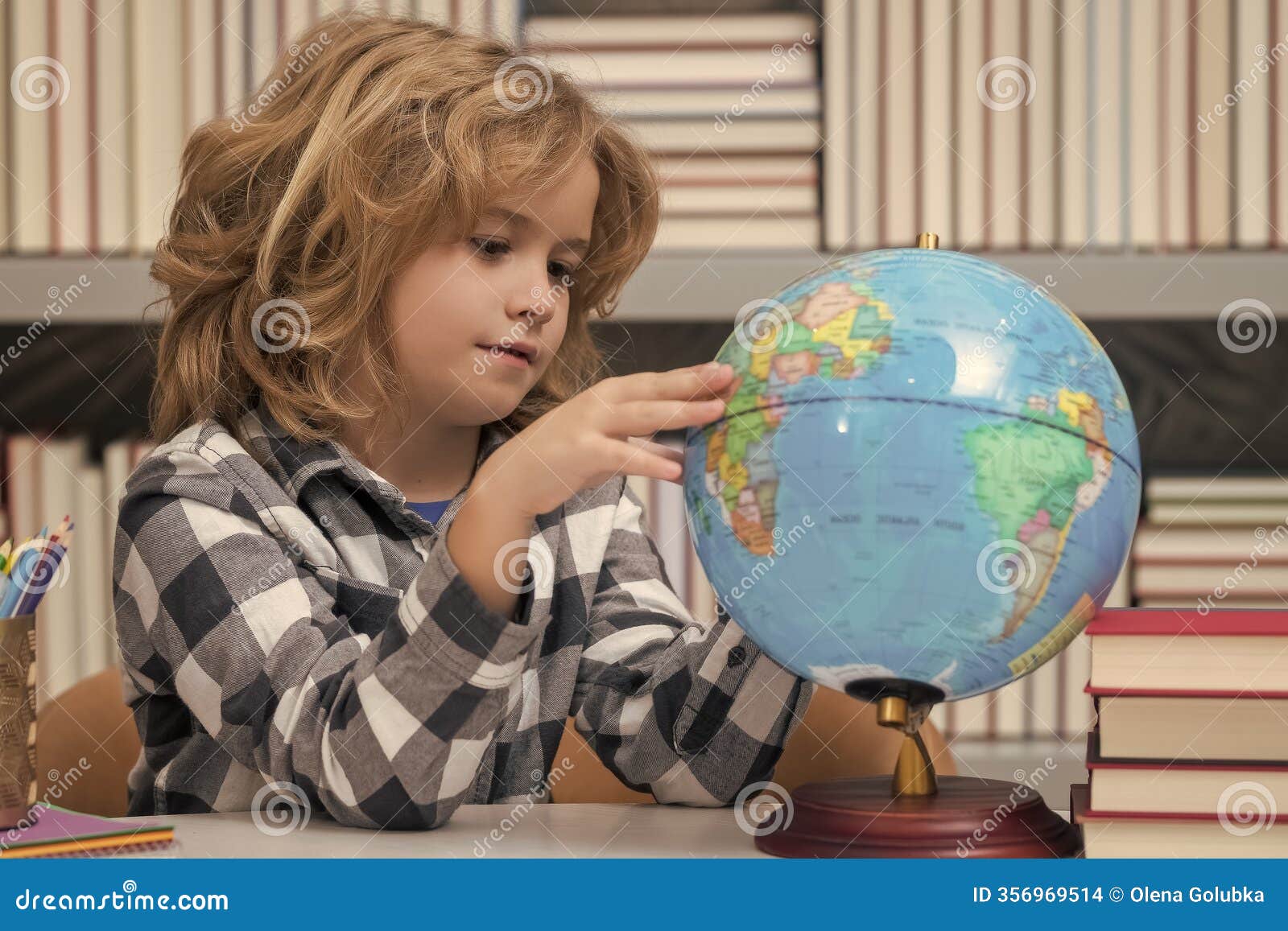 School Pupil Looking at Globe in Library, Geography Lesson. School ...