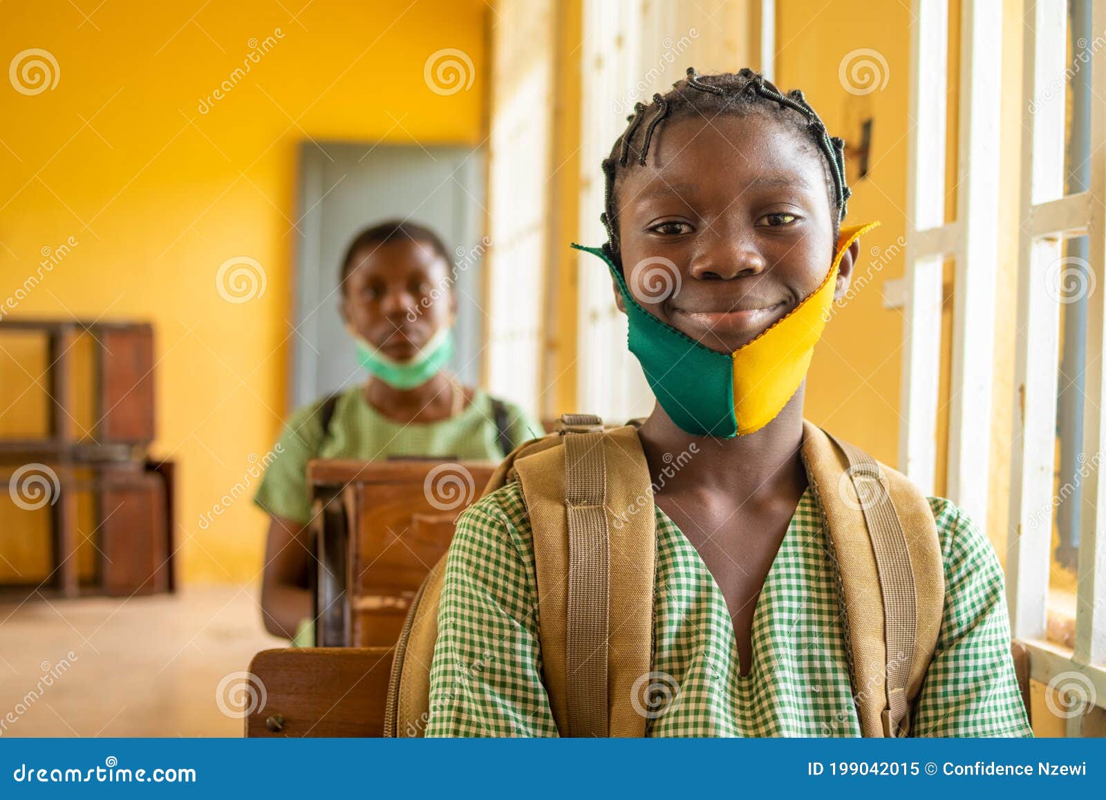 School Pupil`s Sitting in Class, Wearing Face Masks, and Observing ...