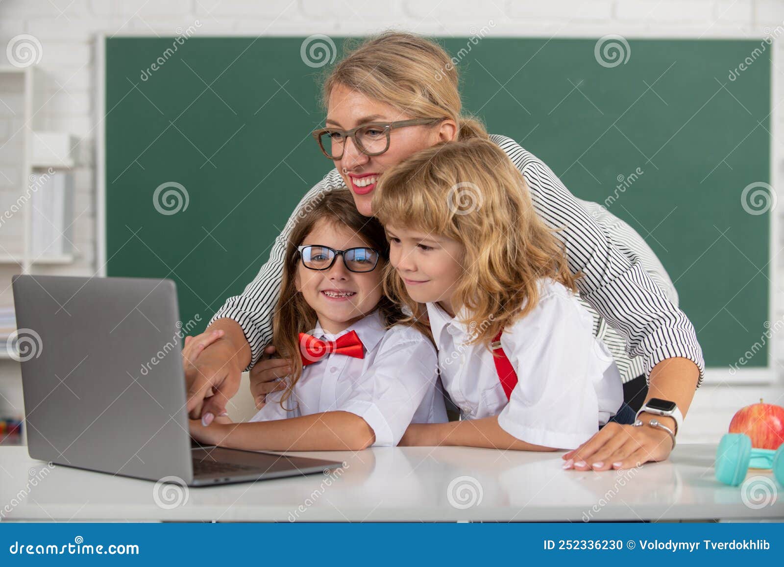 School Pupil with Teacher Learning at Laptop Computer, Studying with ...