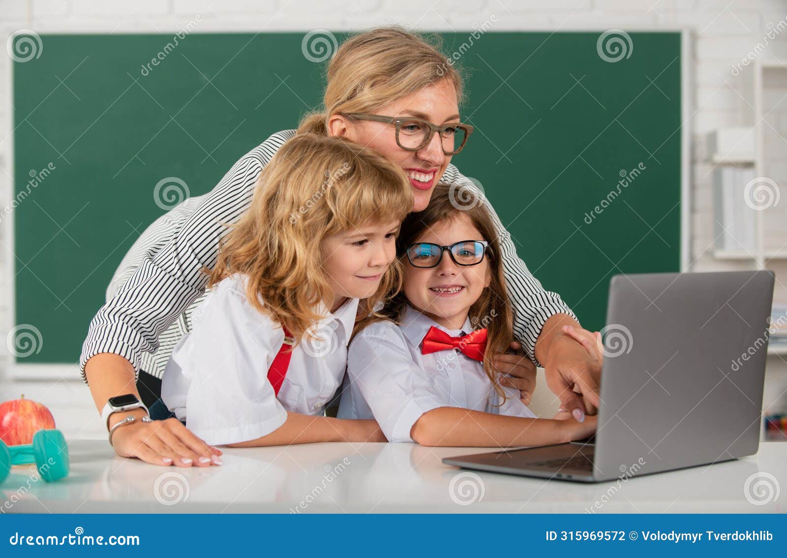 School Pupil with Teacher Learning at Laptop Computer, Studying with ...