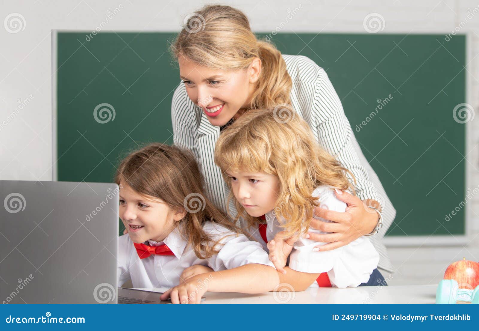 School Pupil with Teacher Learning at Laptop Computer, Studying with ...