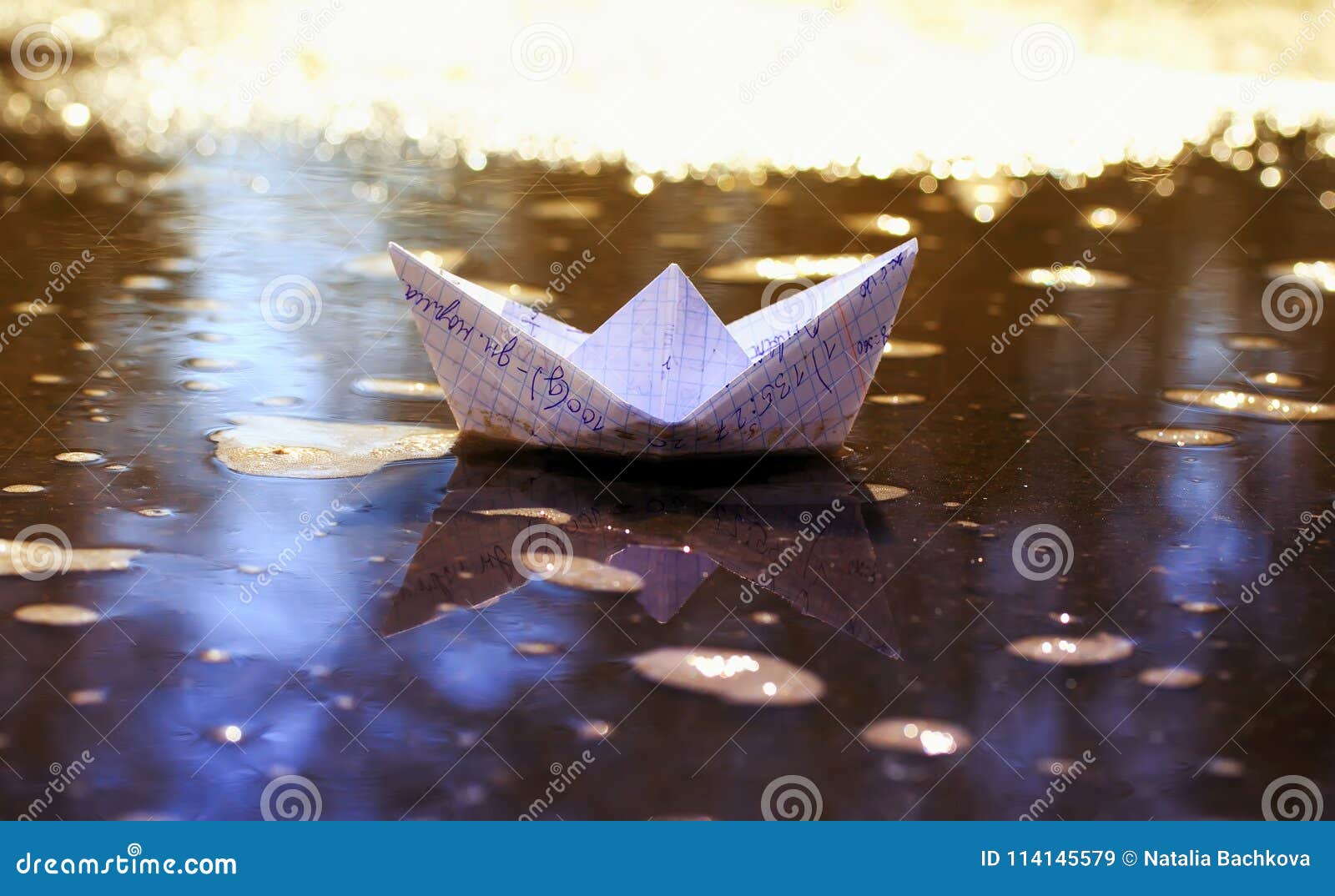 School Small Paper Boat from a Cellular Notebook Floats in the S Stock ...