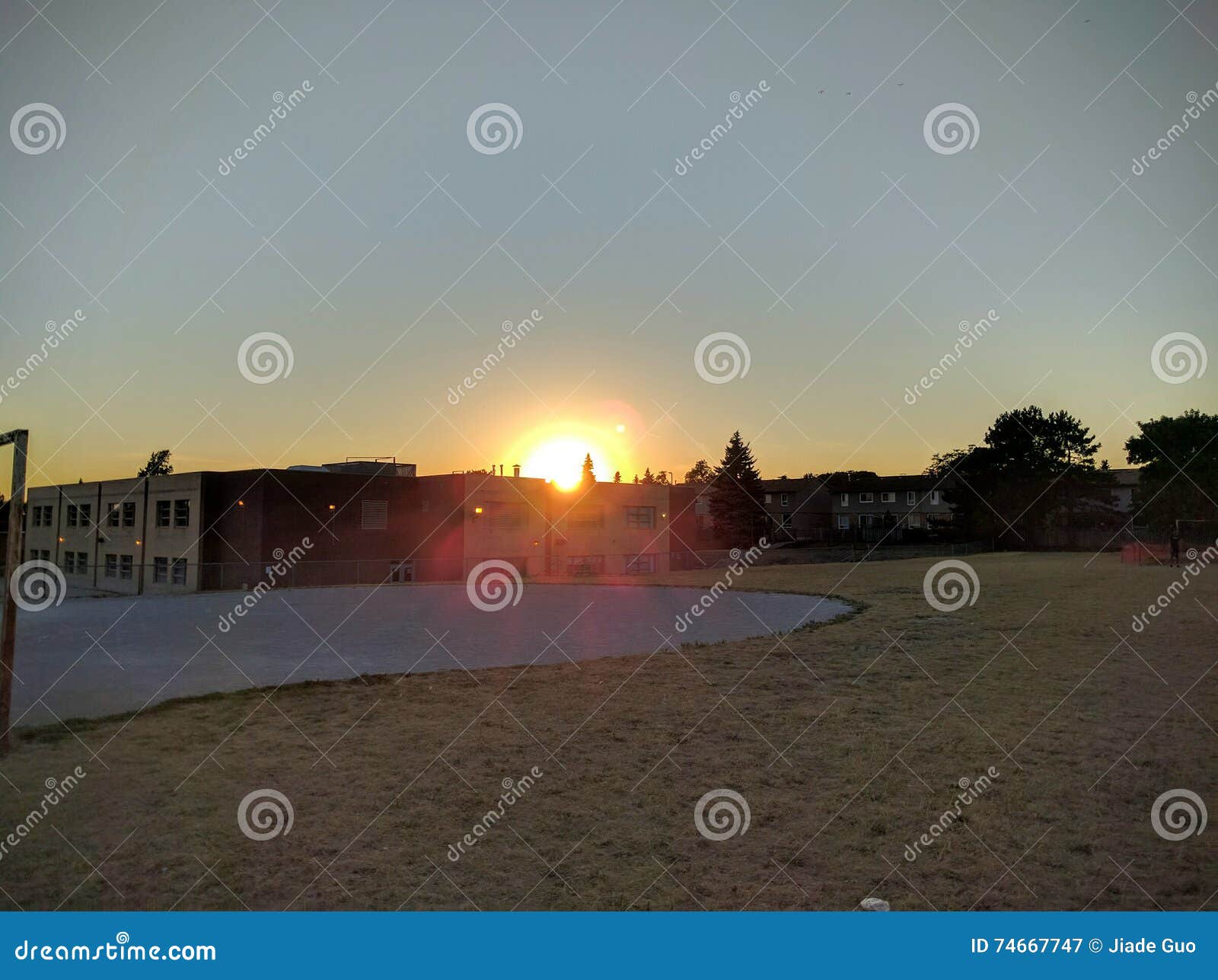 School in sunset stock image. Image of park, lensflare - 74667747
