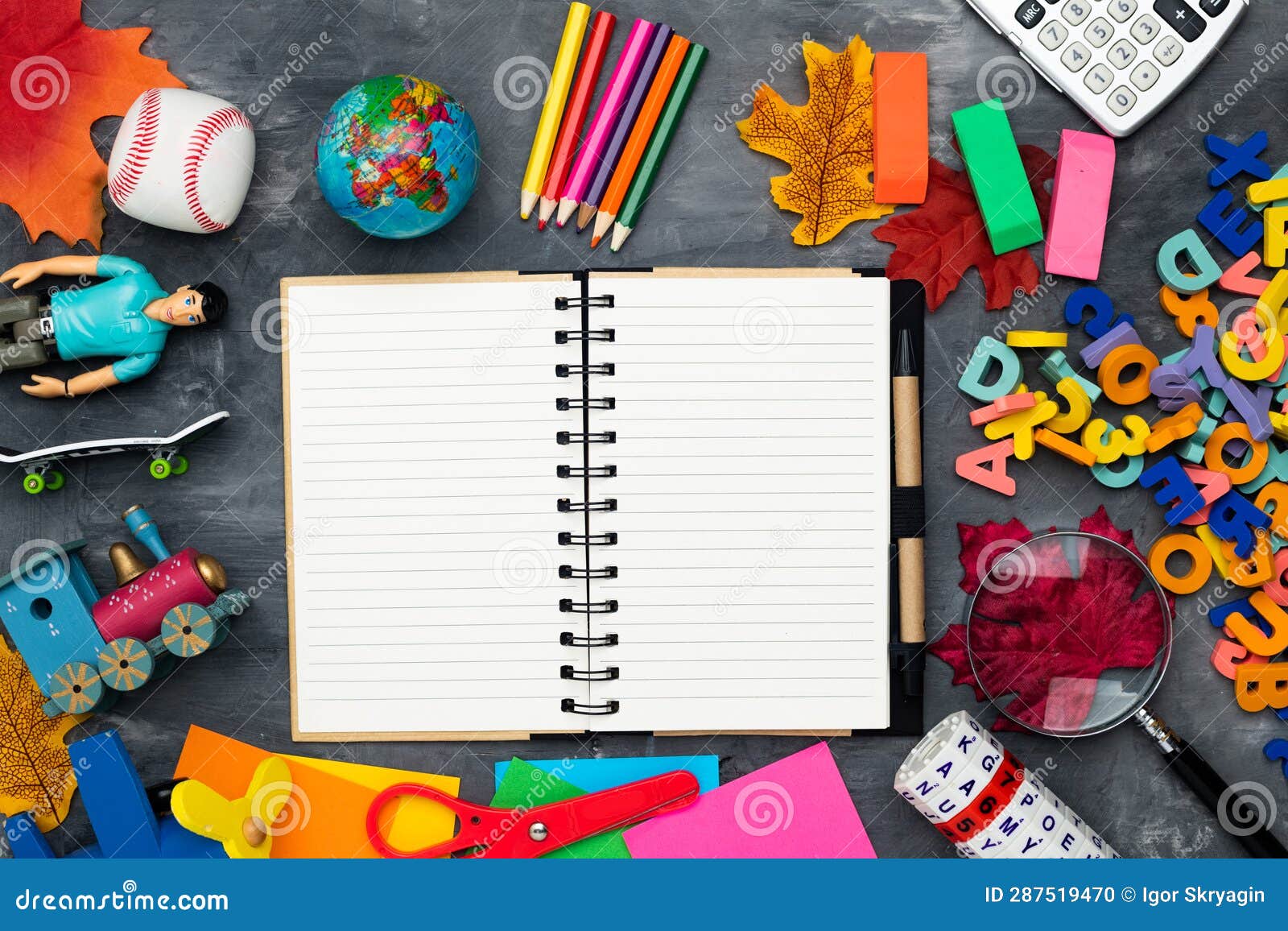 School Supplies, Colored Letters, a Toy and an Empty School Notebook ...