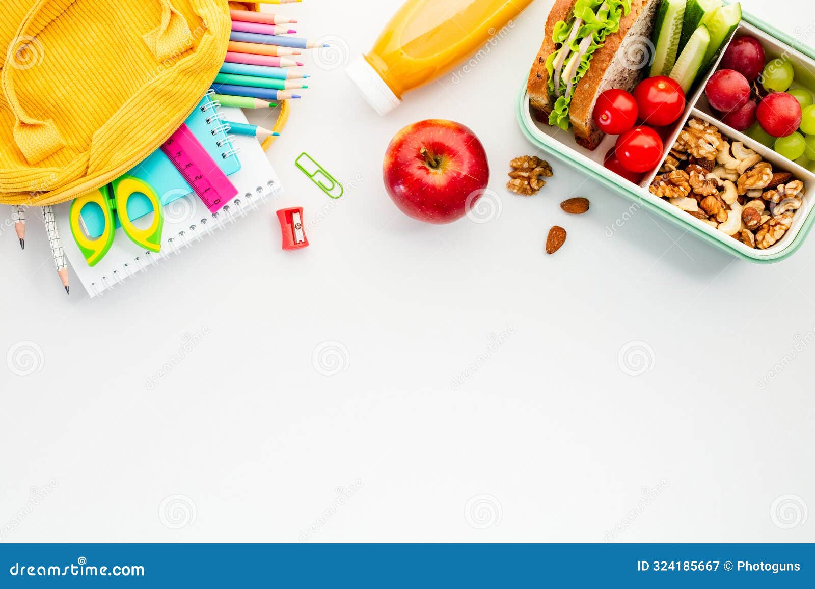 School Supplies and a Healthy Lunch Set Against a White Backdrop, Ideal ...